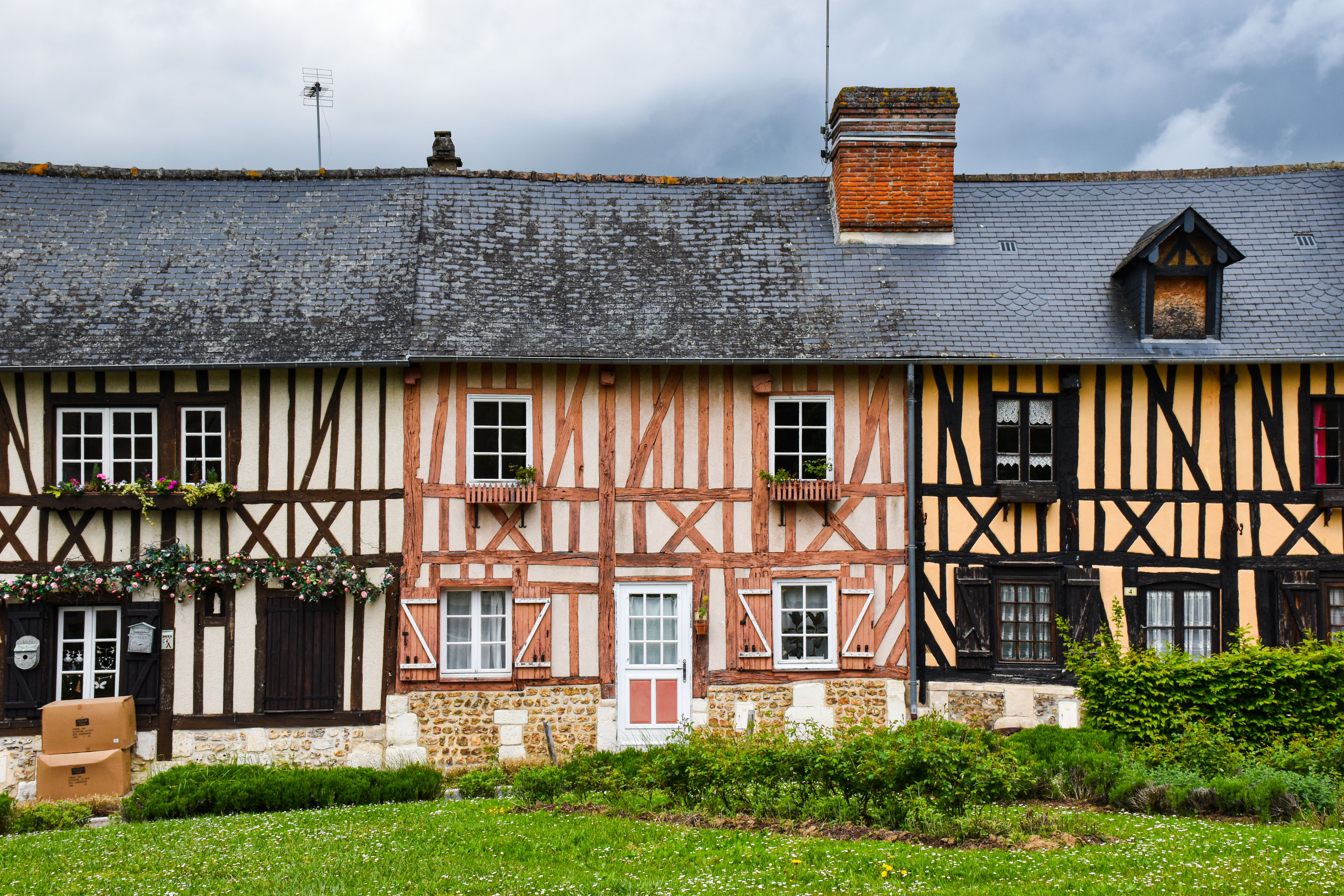 A row of old houses with wooden shutters · Free Stock Photo