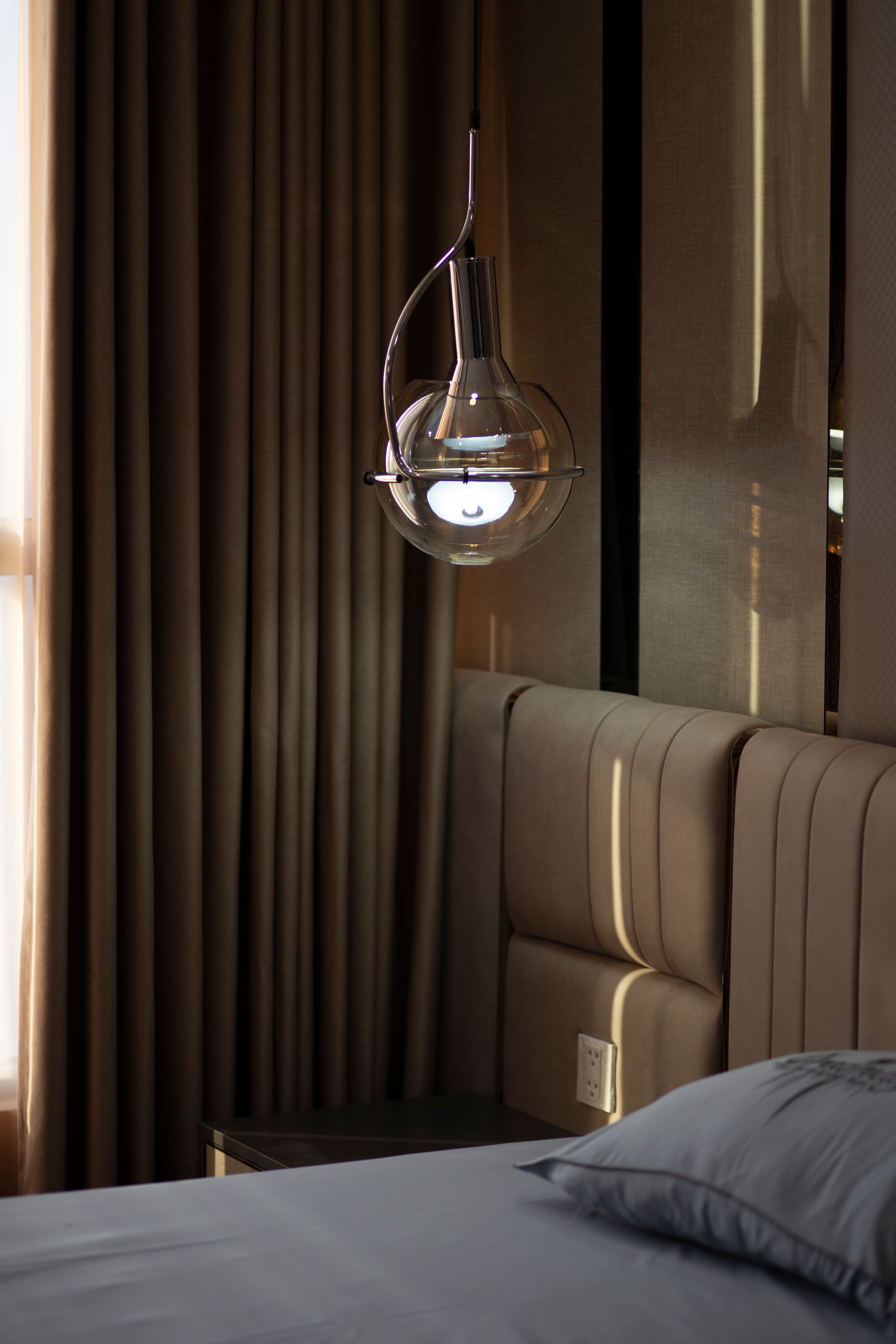 A modern bed with a lamp on it · Free Stock Photo
