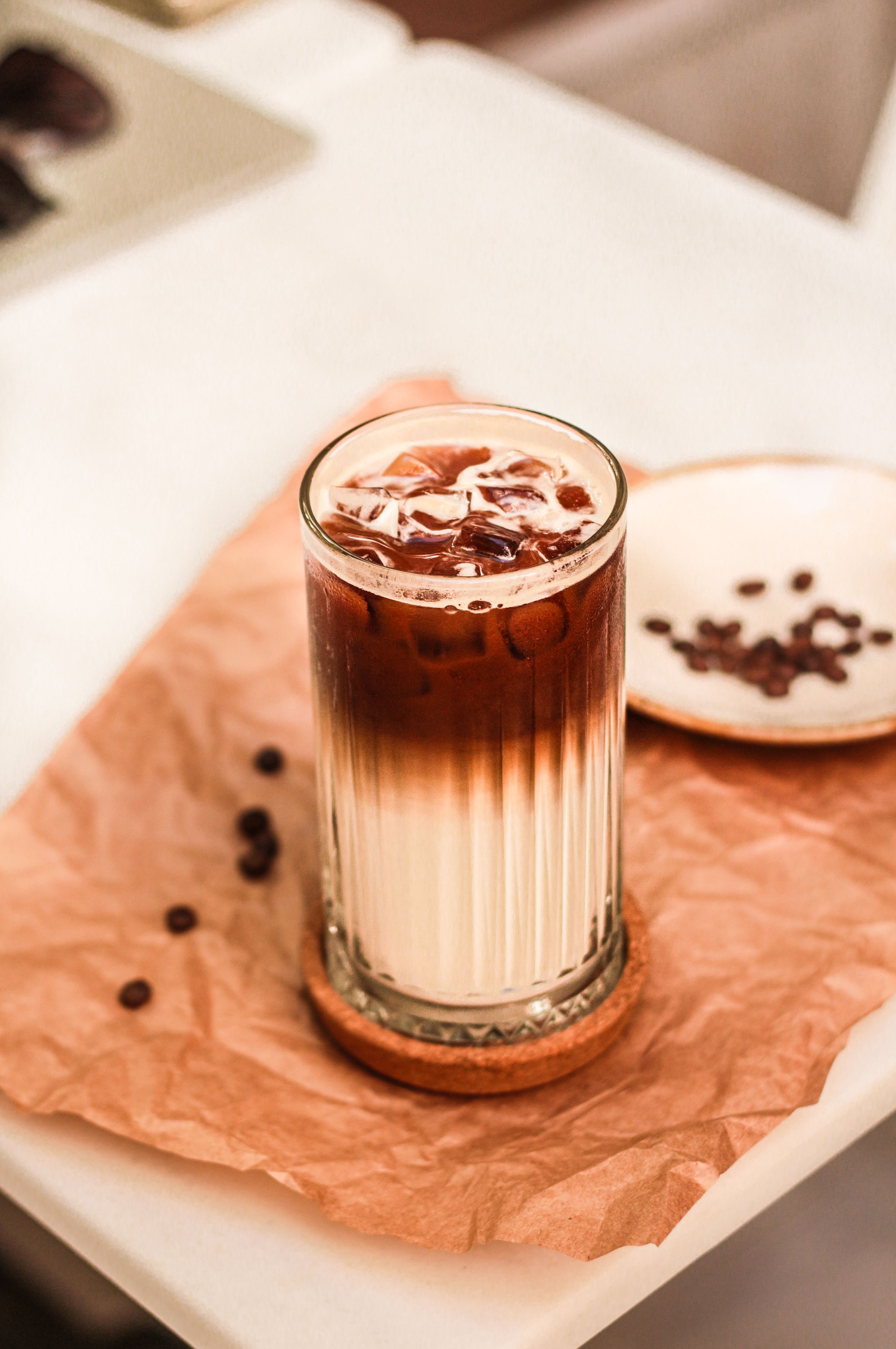 A glass of coffee with ice cream and coffee beans · Free Stock Photo