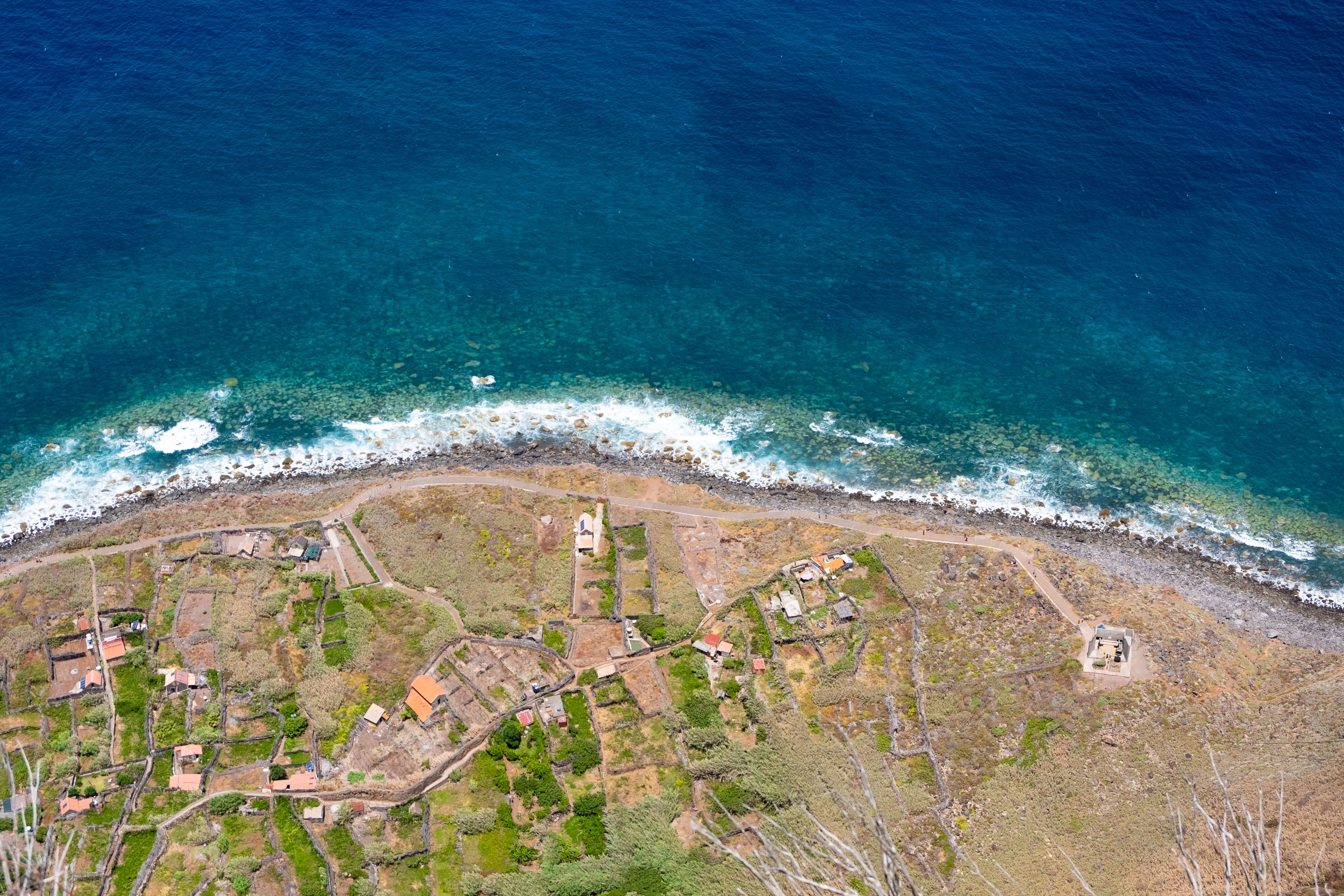 A view of a beach and a small town from above · Free Stock Photo