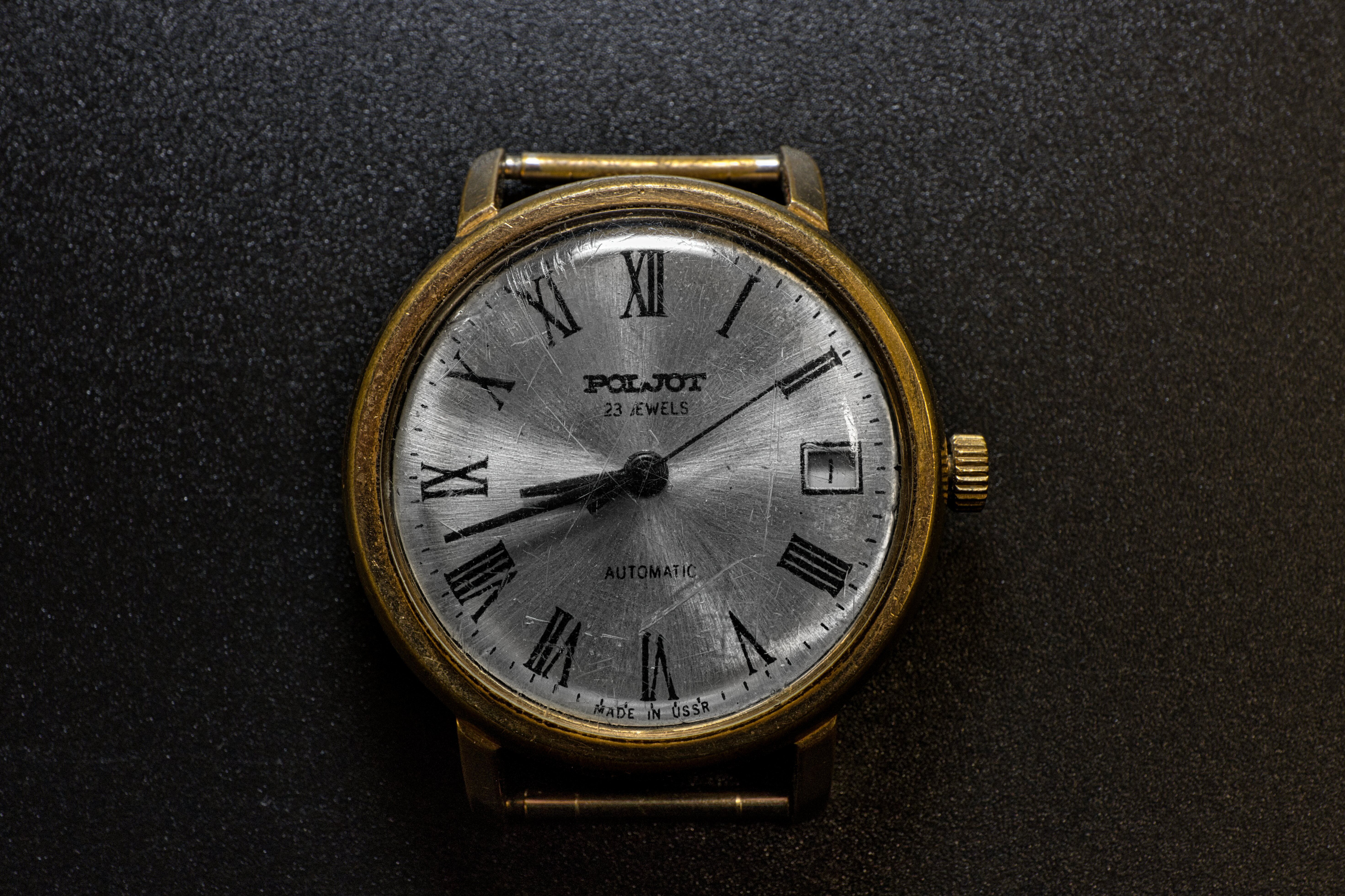A vintage watch with roman numerals on the face · Free Stock Photo