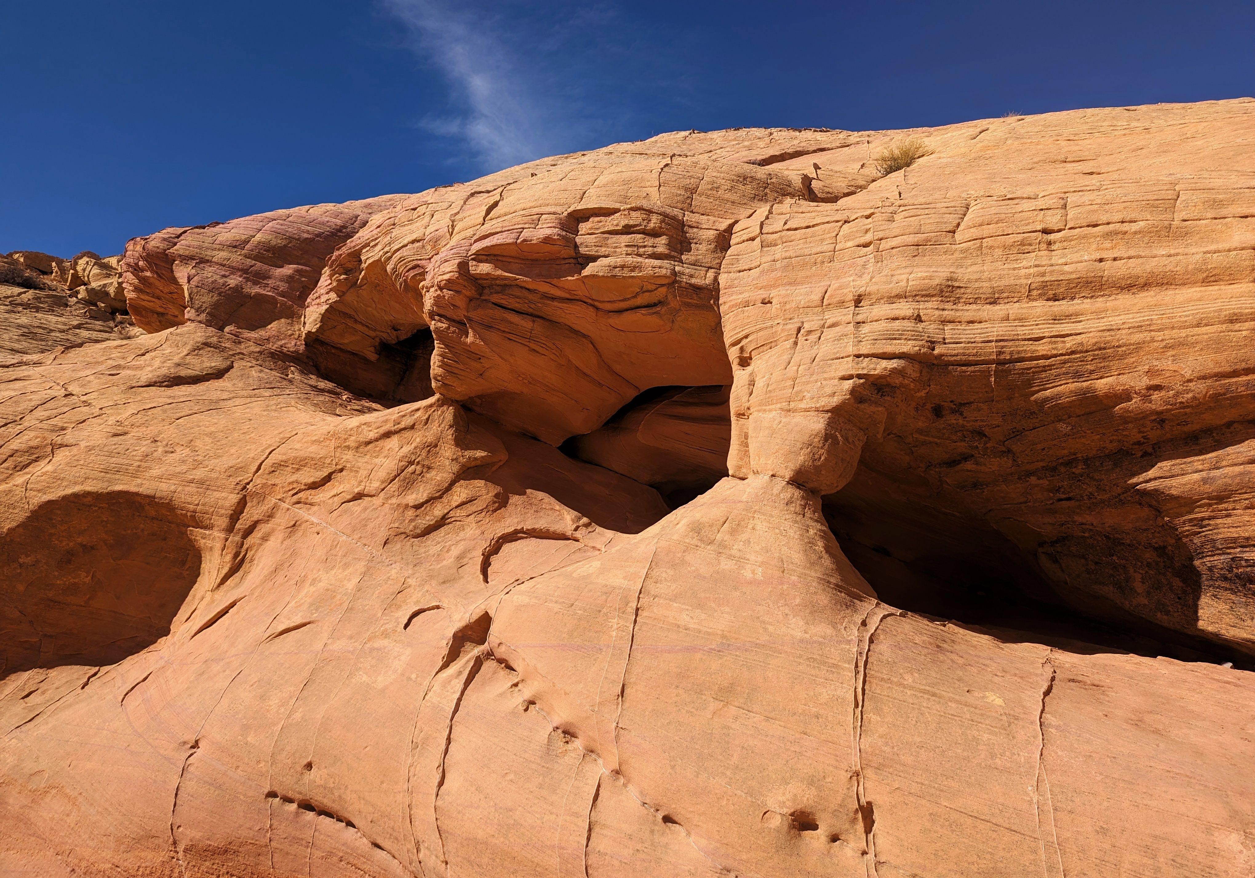 A rock formation with a hole in it · Free Stock Photo