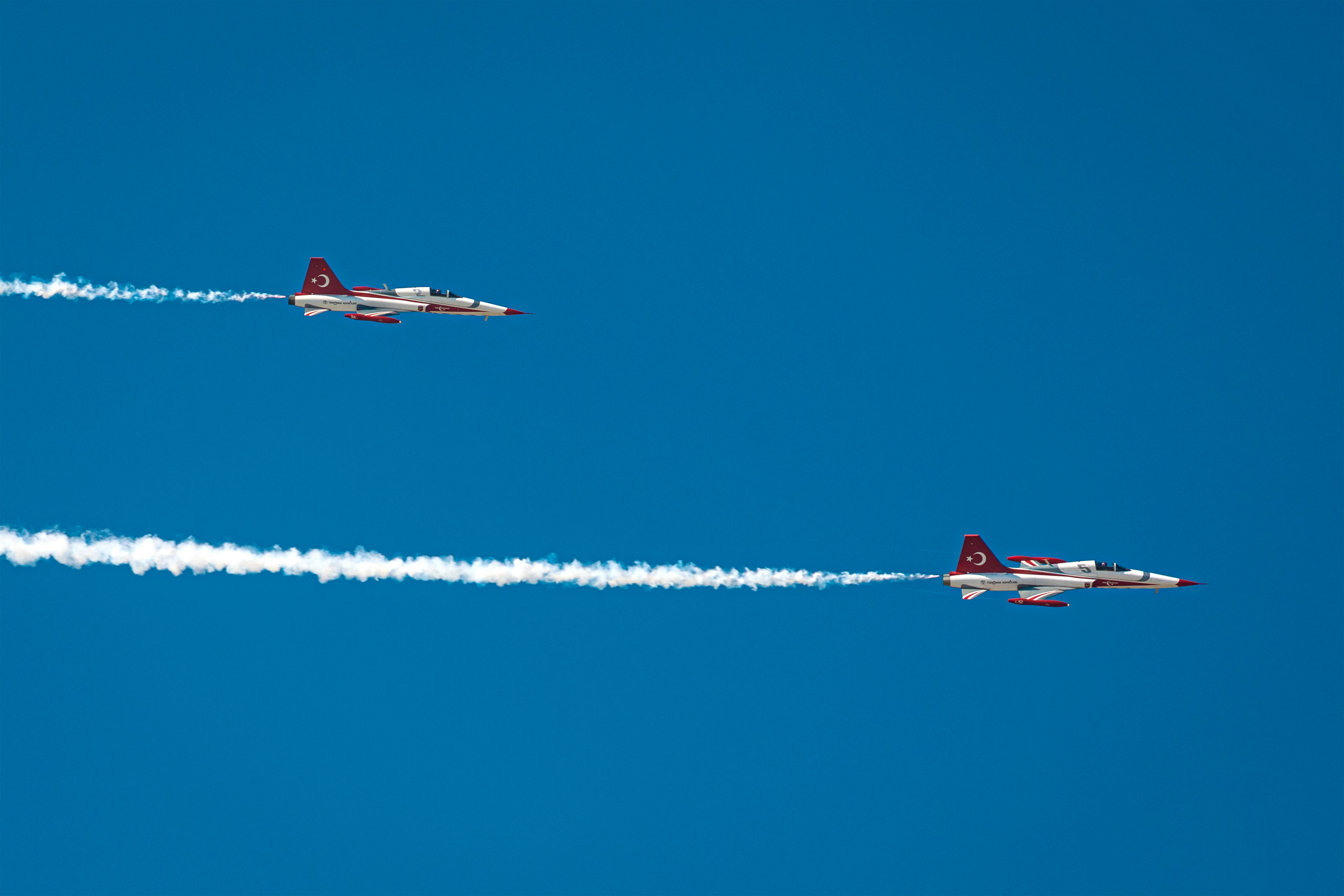Two jets flying in the sky · Free Stock Photo