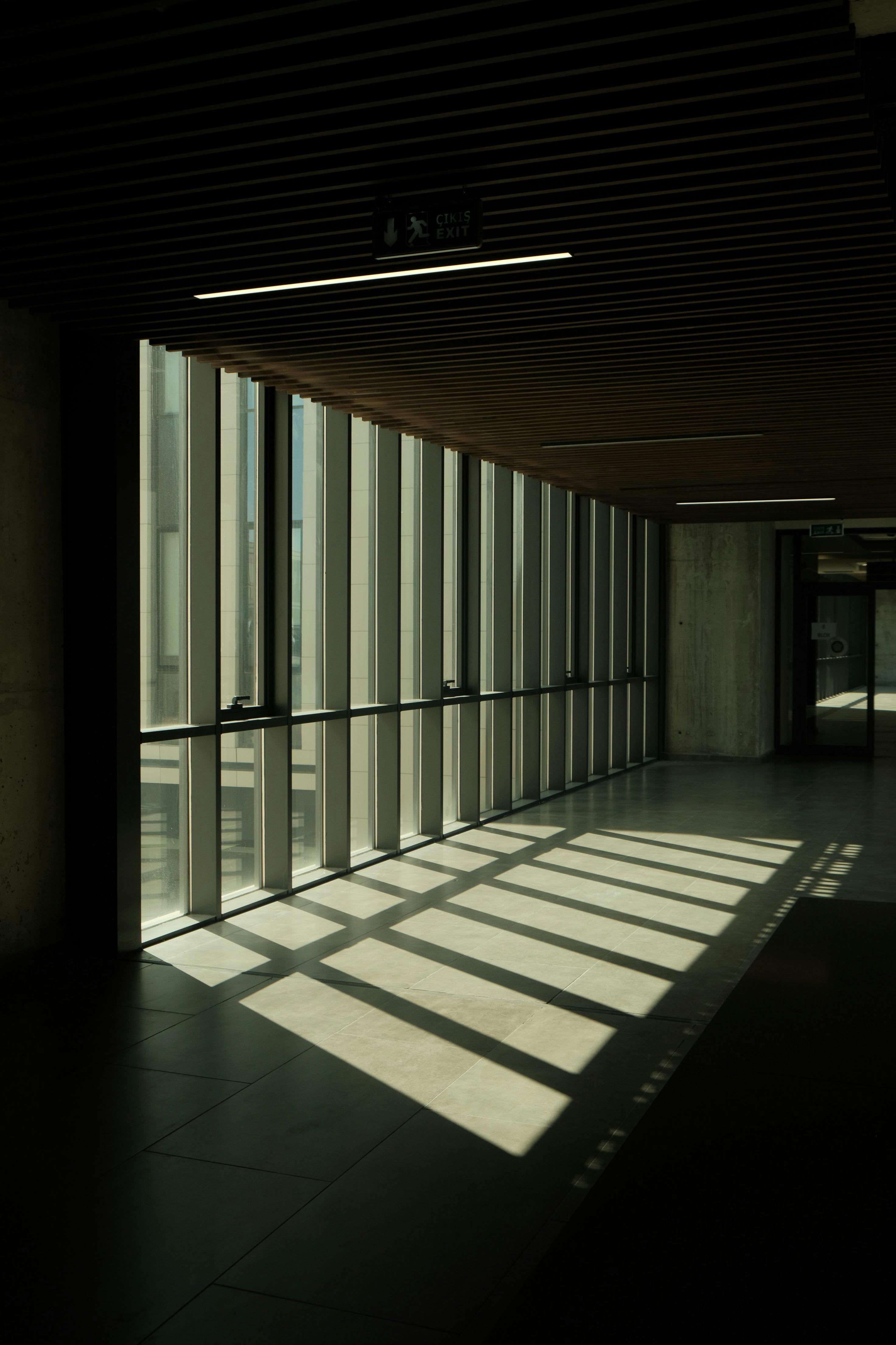 Window of geometrical shaped walls in dark building · Free Stock Photo