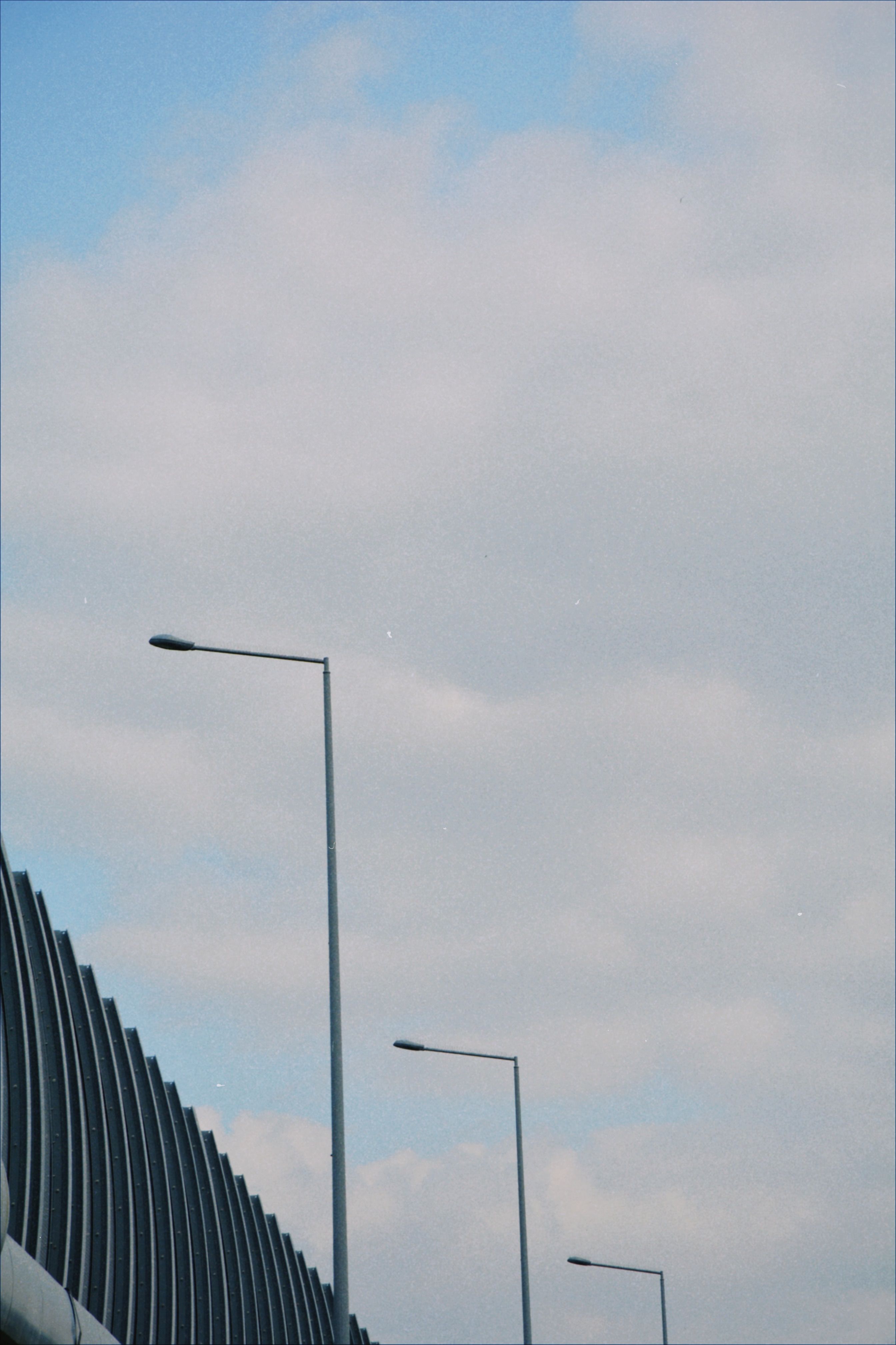 A street light is on the side of a bridge · Free Stock Photo