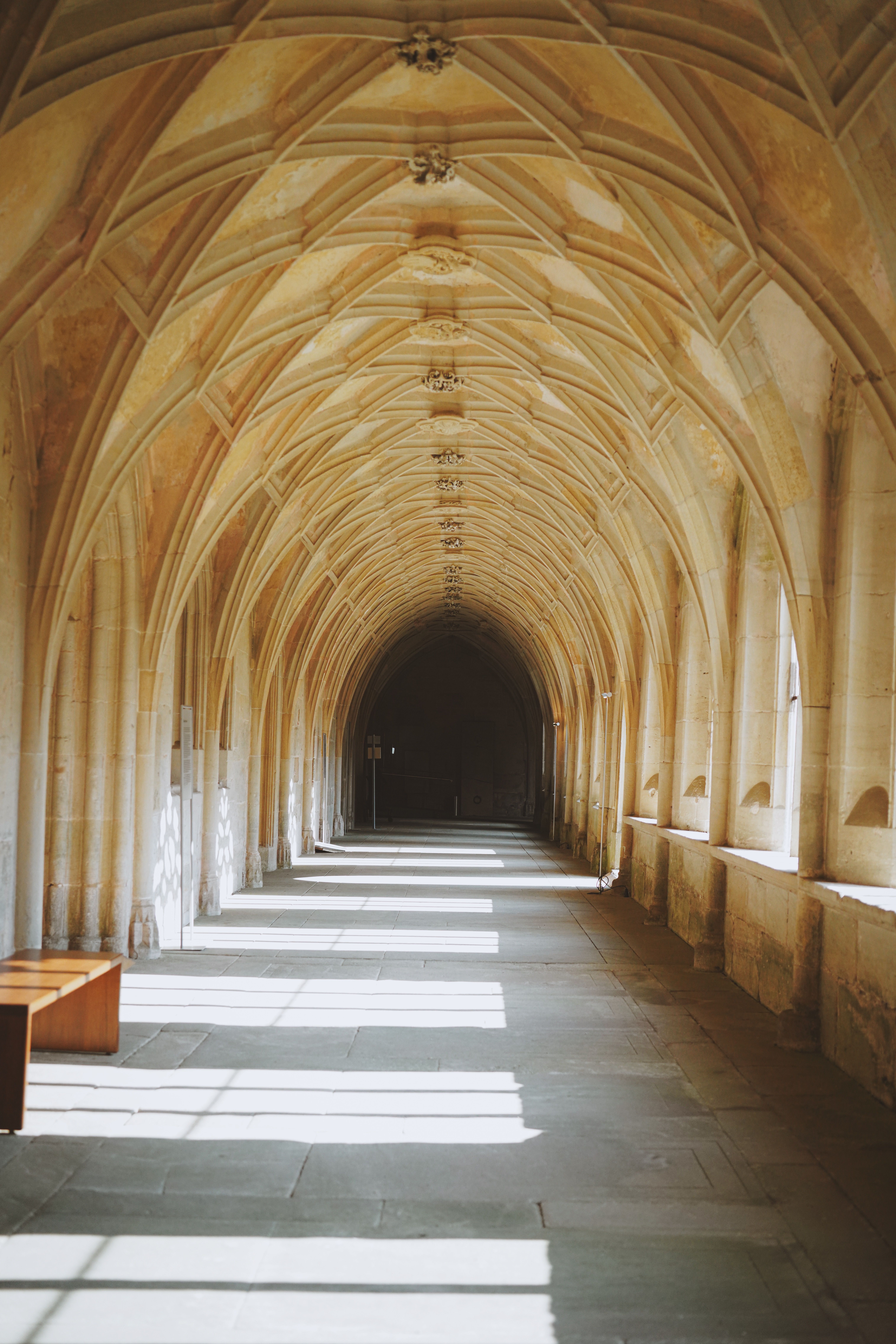 The inside of a long, narrow building with arches · Free Stock Photo