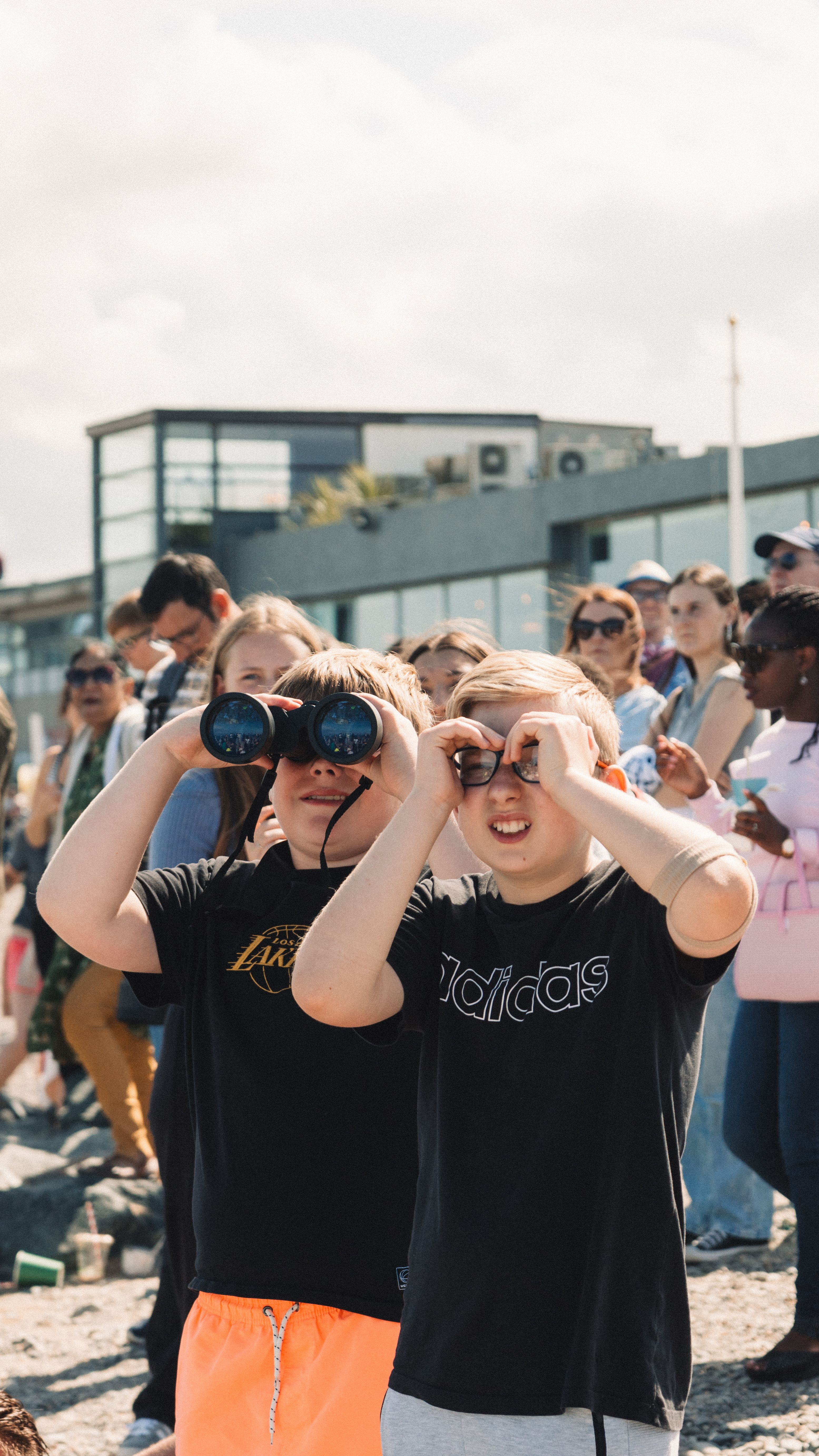 Two people looking at the camera with their hands up · Free Stock Photo
