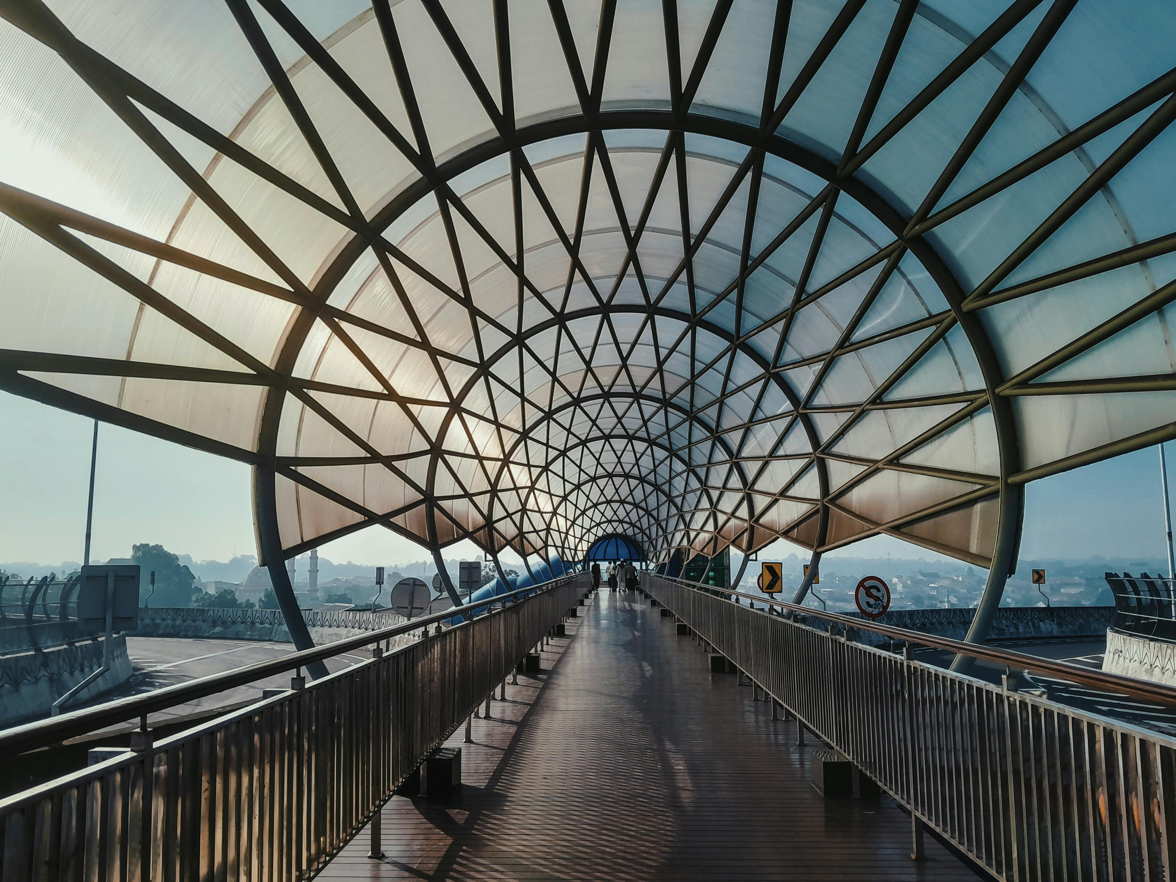 Modern Pedestrian Bridge with Architectural Roof Design · Free Stock Photo