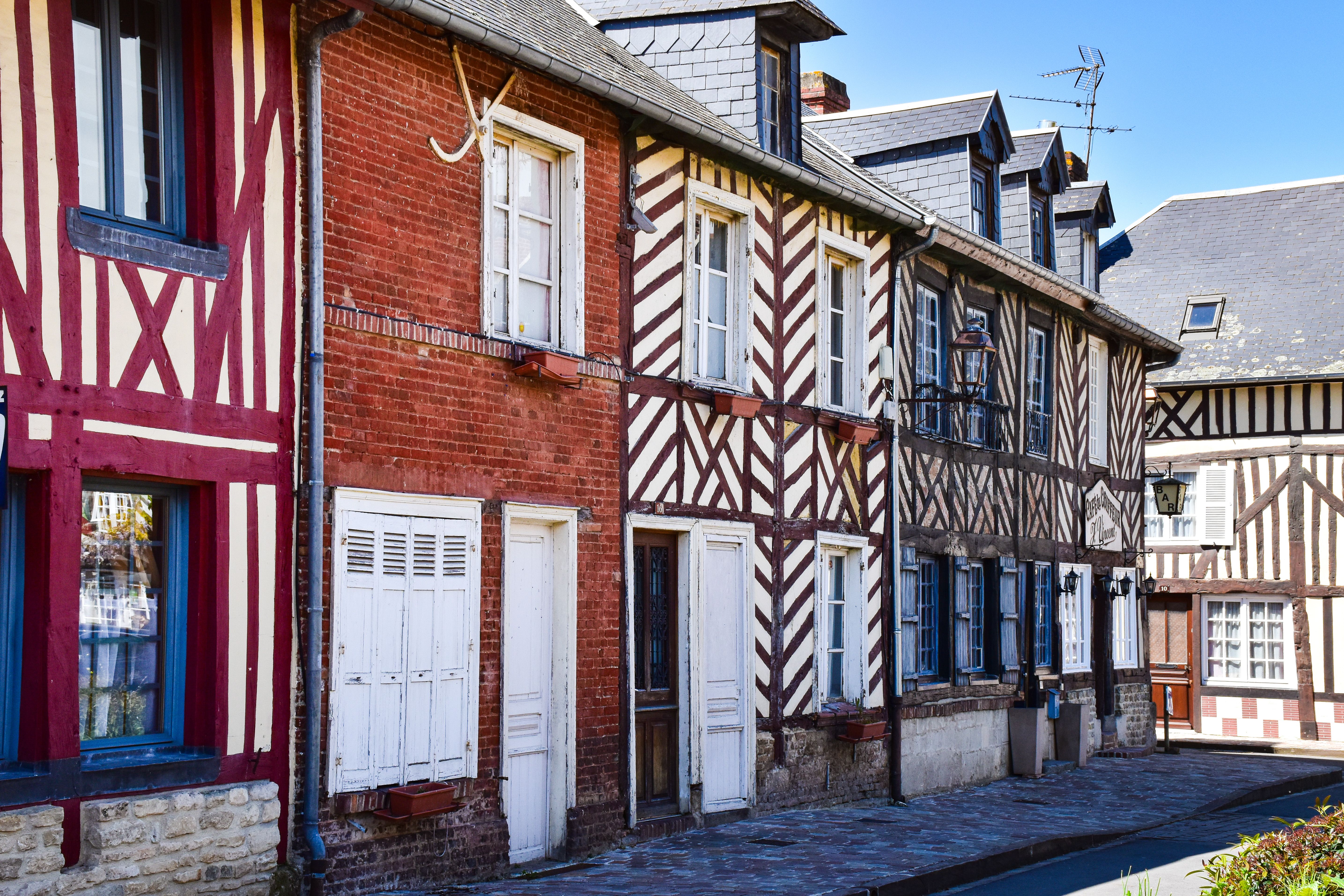 A row of old houses with wooden shutters · Free Stock Photo