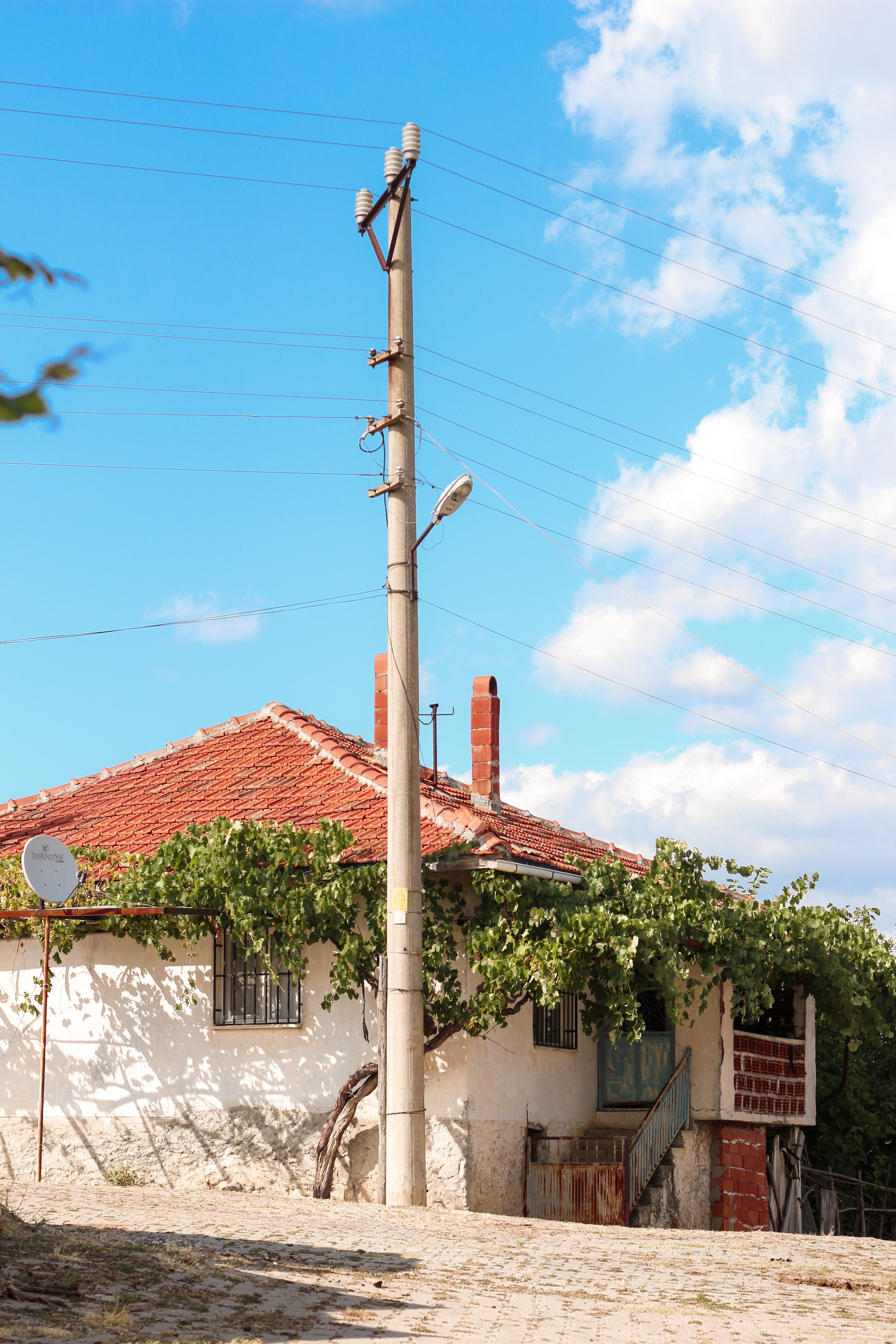 A house with a telephone pole and a tree · Free Stock Photo