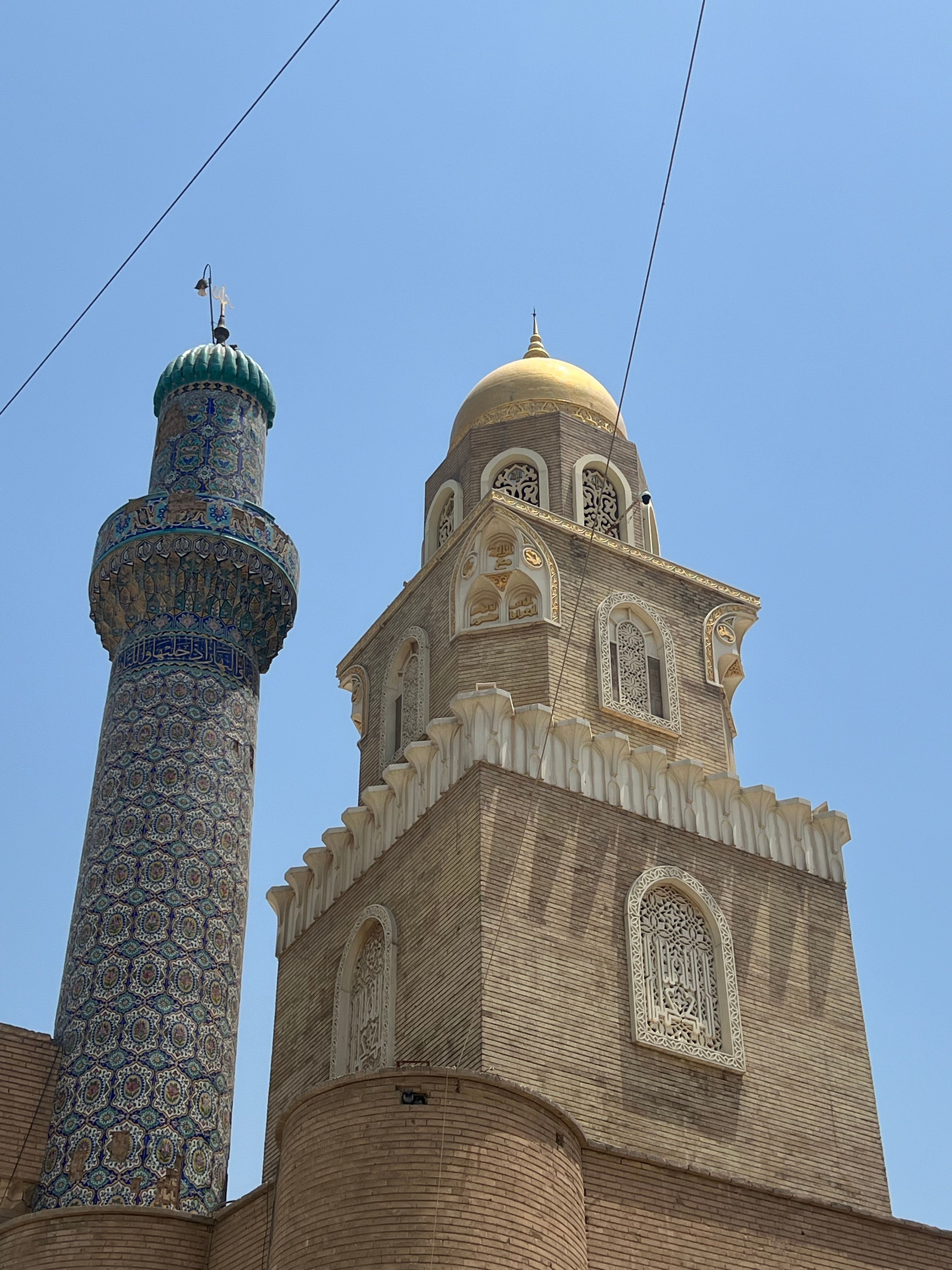 Two tall buildings with gold domes and a blue sky · Free Stock Photo