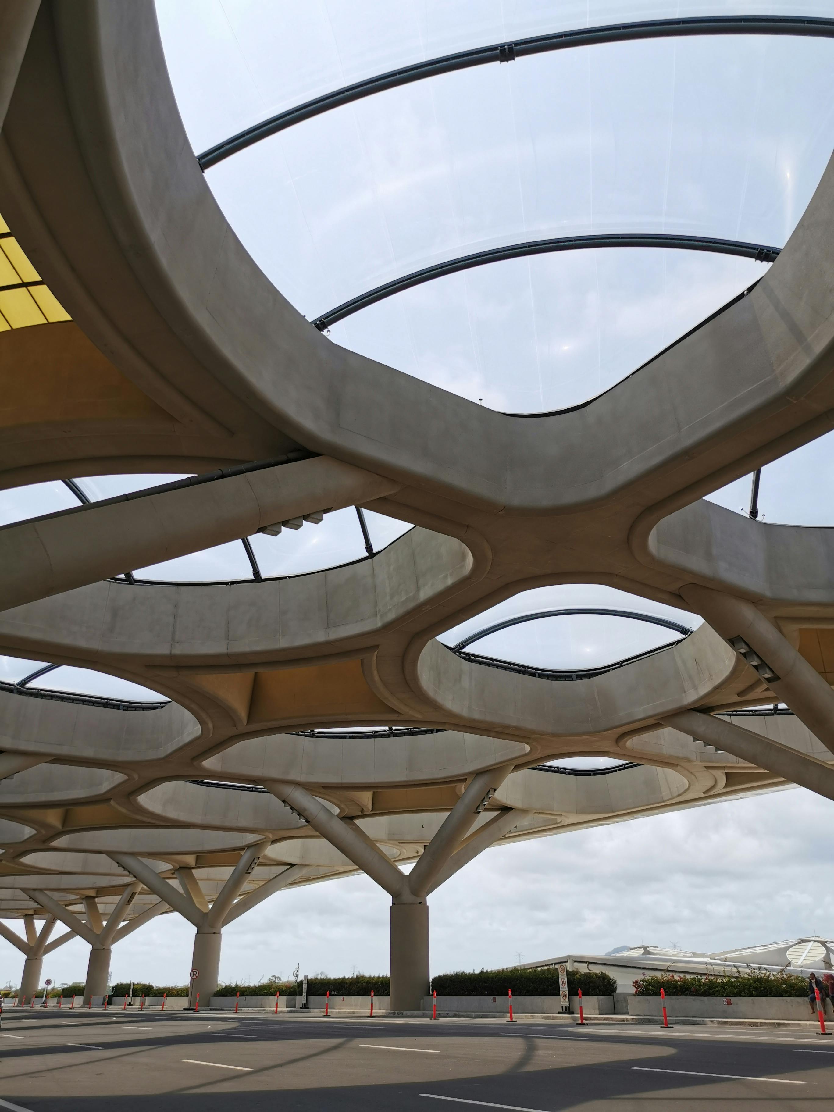 The roof of an airport terminal is covered in circular shapes · Free ...