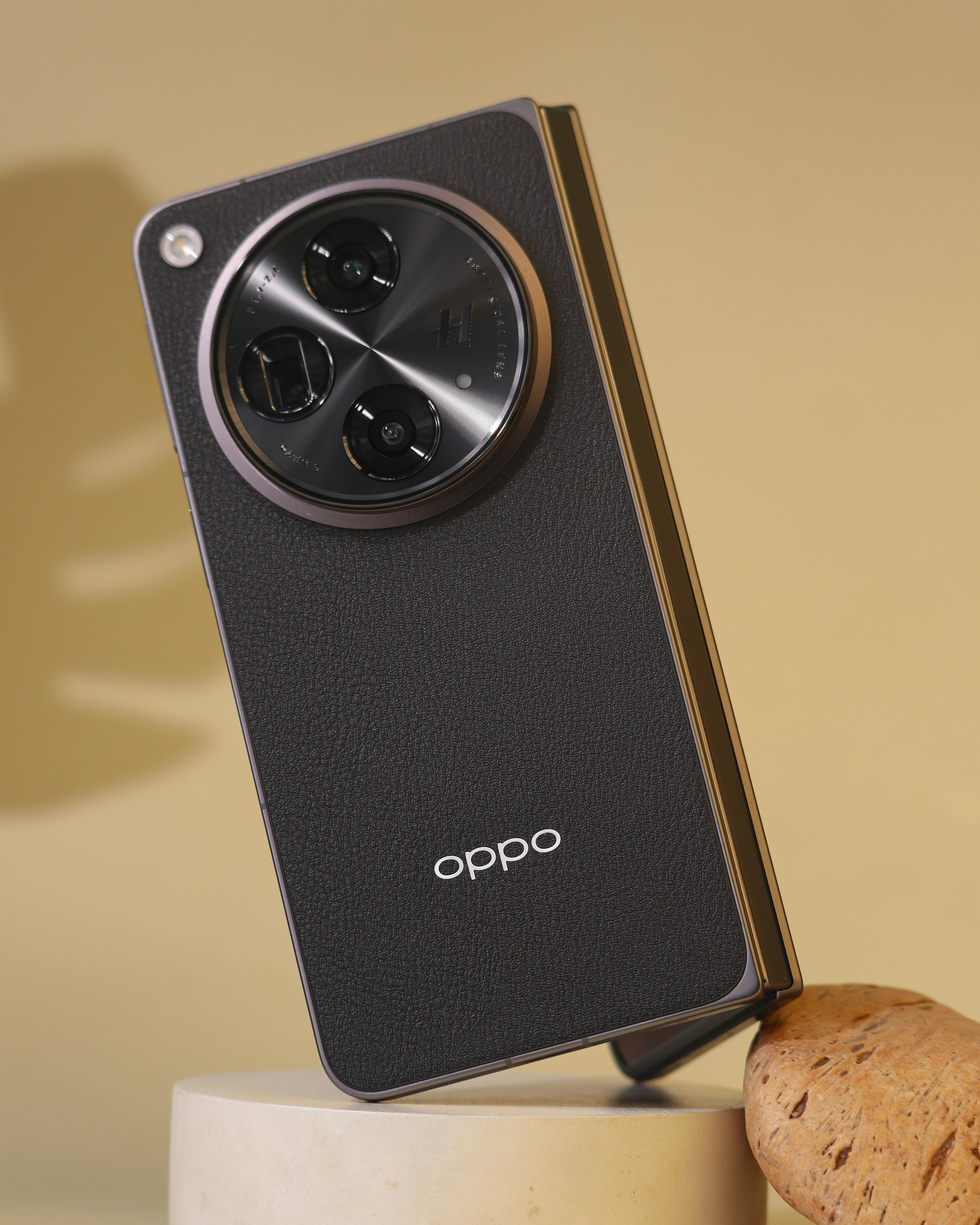 Oppo power bank with a cell phone on top · Free Stock Photo
