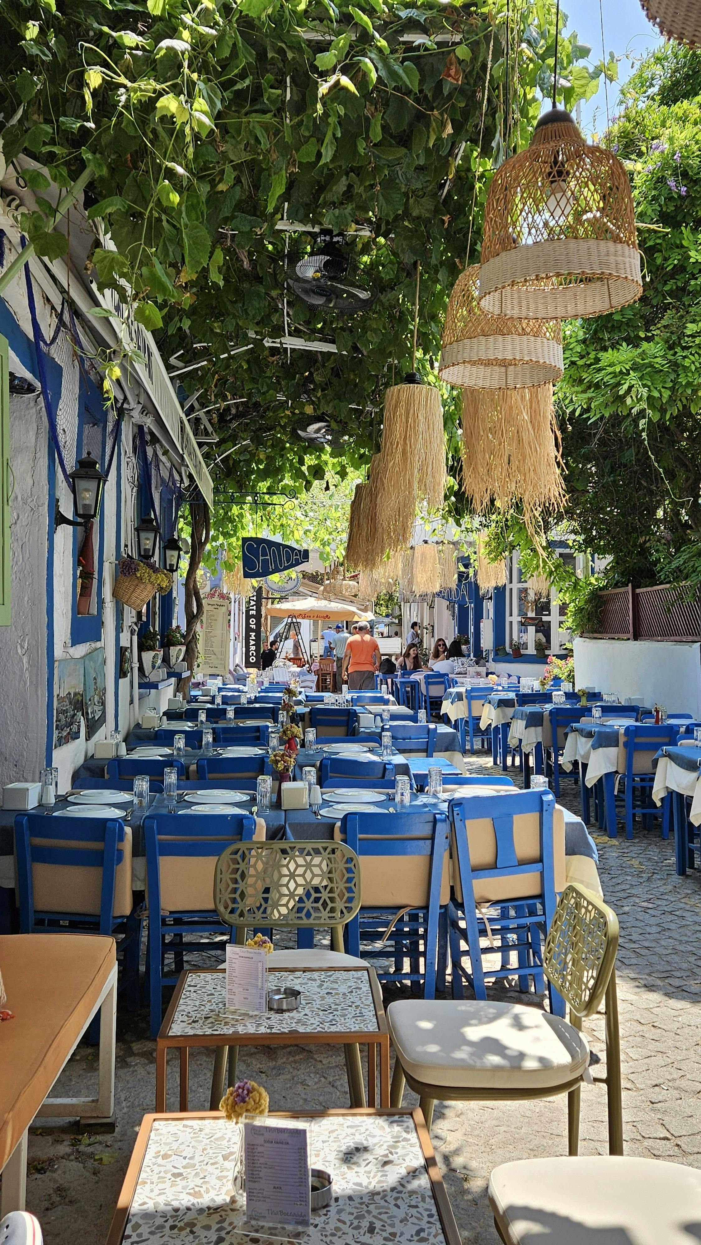A restaurant with blue tables and chairs · Free Stock Photo