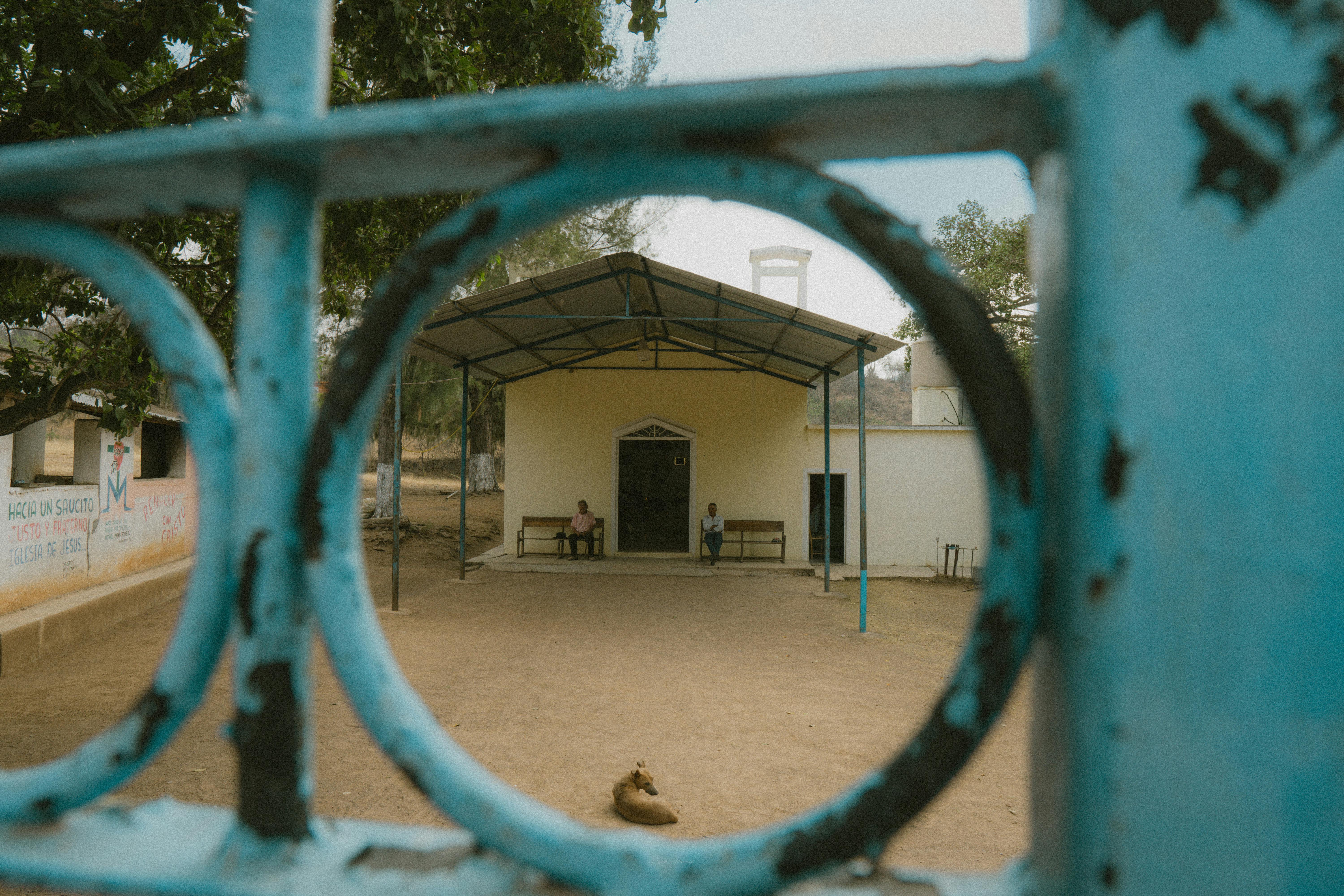 A blue metal gate with a blue window · Free Stock Photo