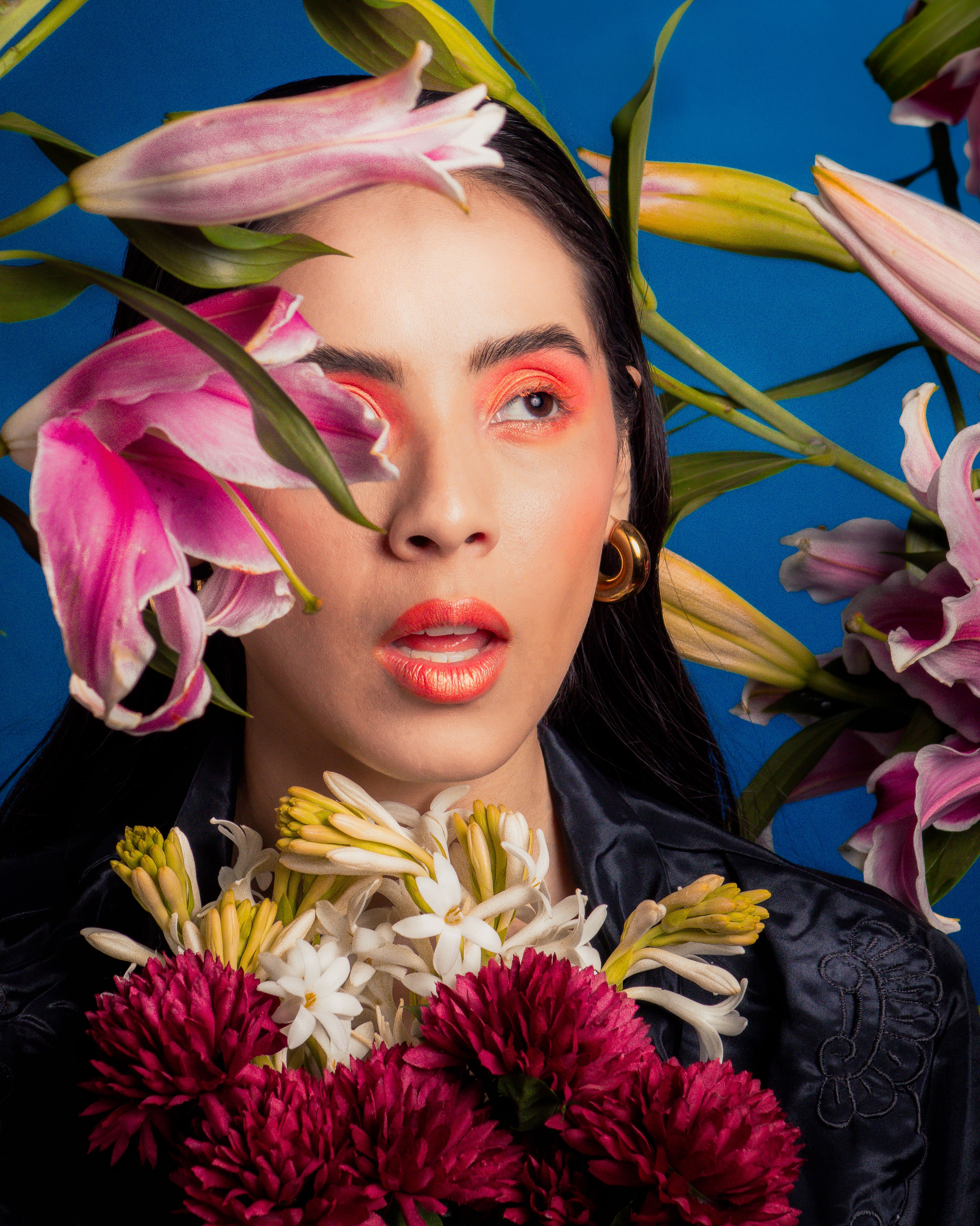A woman with flowers in her hair and a flower in her mouth · Free Stock ...