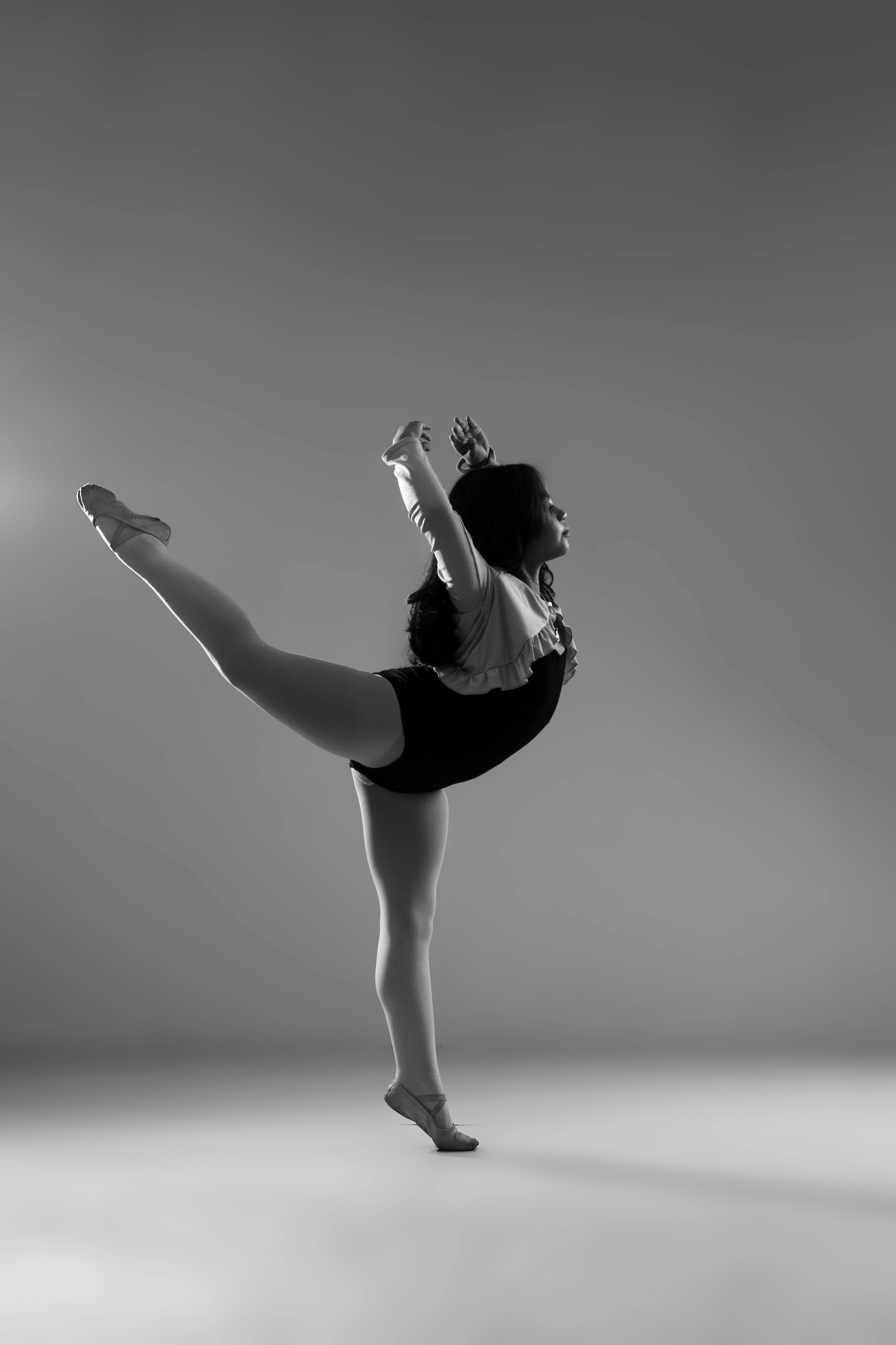 Woman Doing Ballet Dance on Side Walk in Grayscale Photo · Free Stock Photo