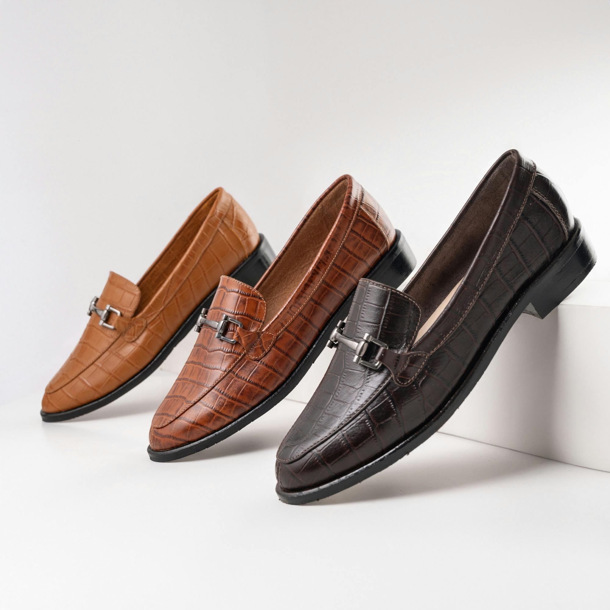 Three pairs of loafers with croc embossed leather · Free Stock Photo