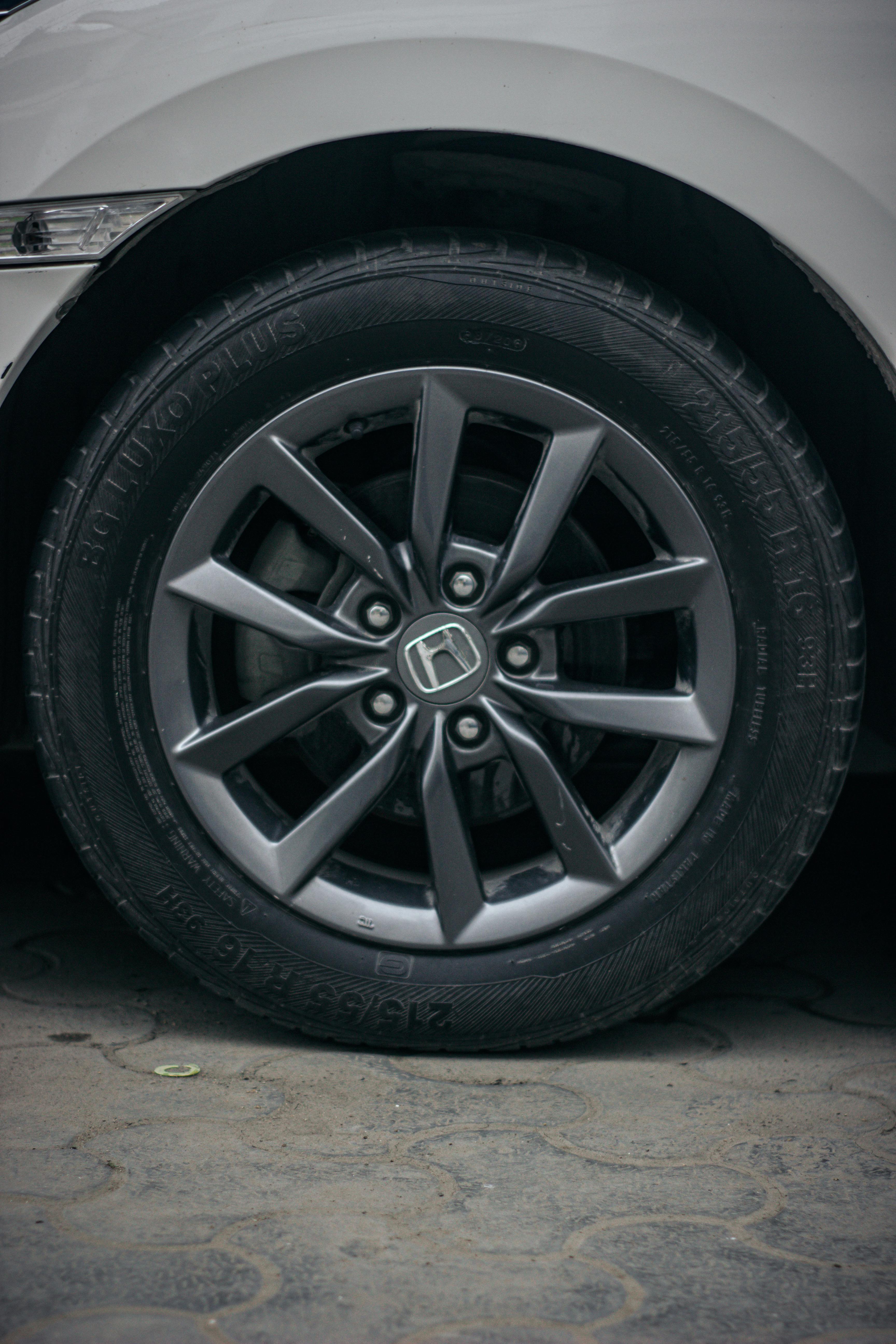 The wheel of a car with a tire on it · Free Stock Photo