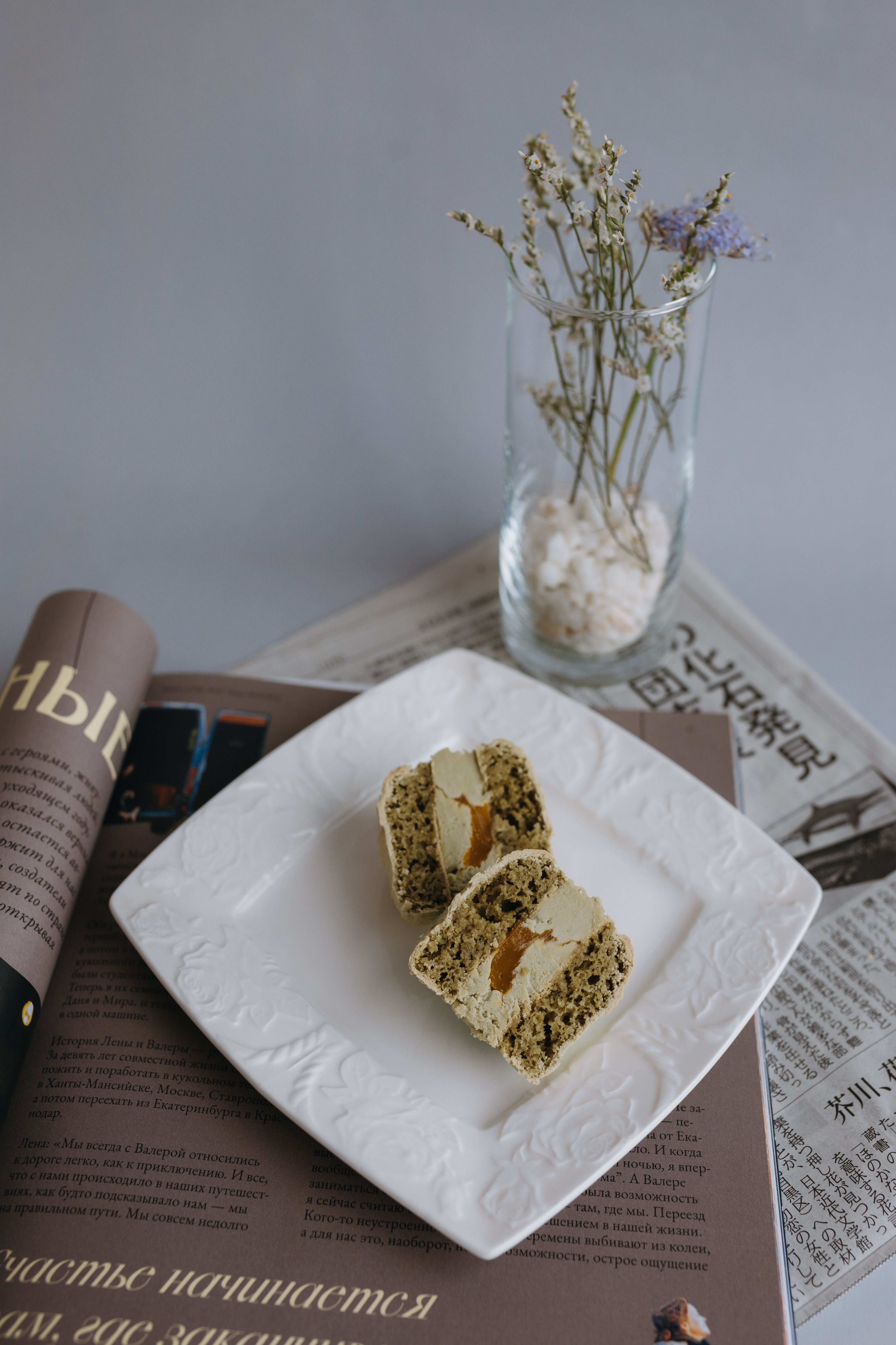 A plate of cake with a newspaper on it · Free Stock Photo