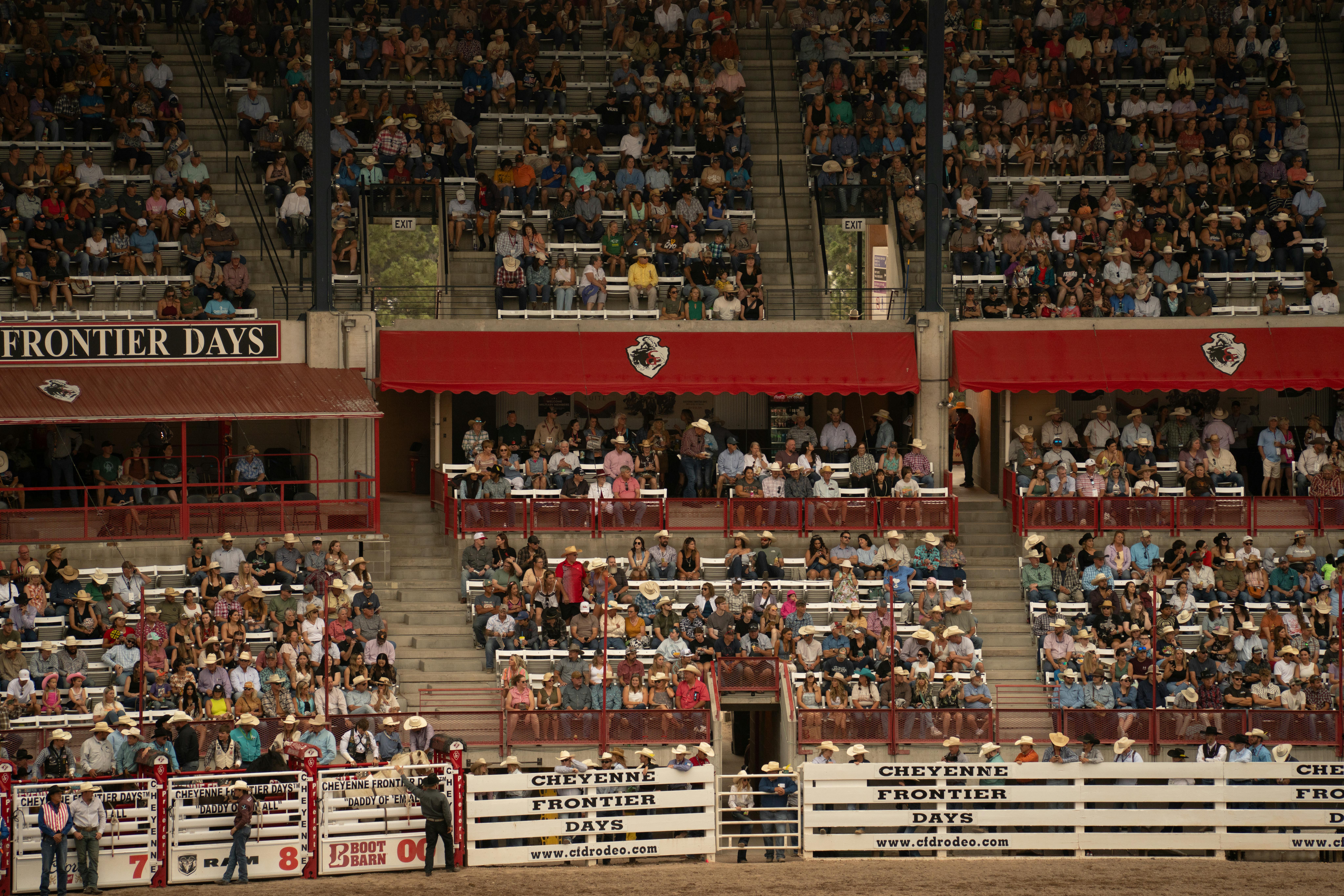 A large crowd of people watching a rodeo · Free Stock Photo