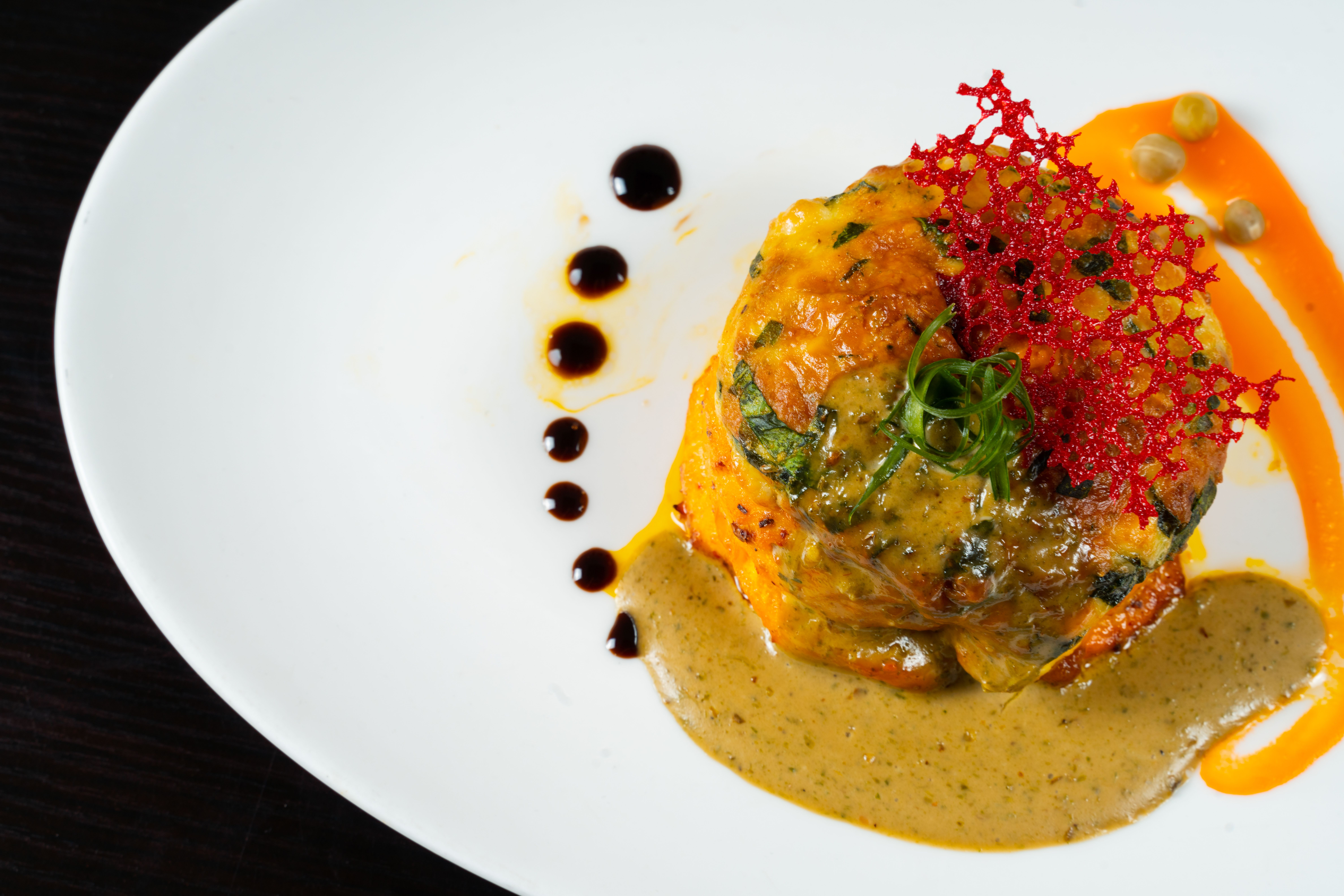 A white plate topped with a dish of food · Free Stock Photo