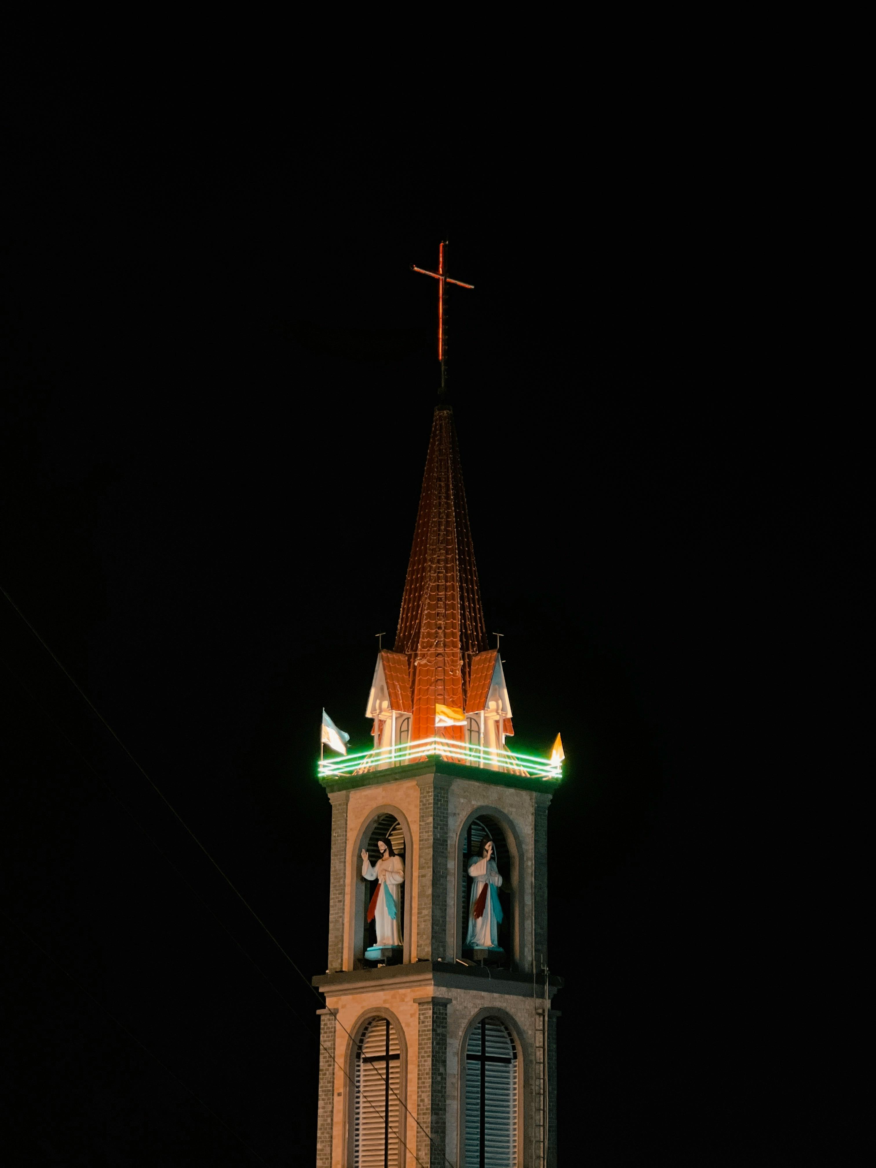 Bell Tower with Statues of Jesus Christ and Neon Lighting · Free Stock ...