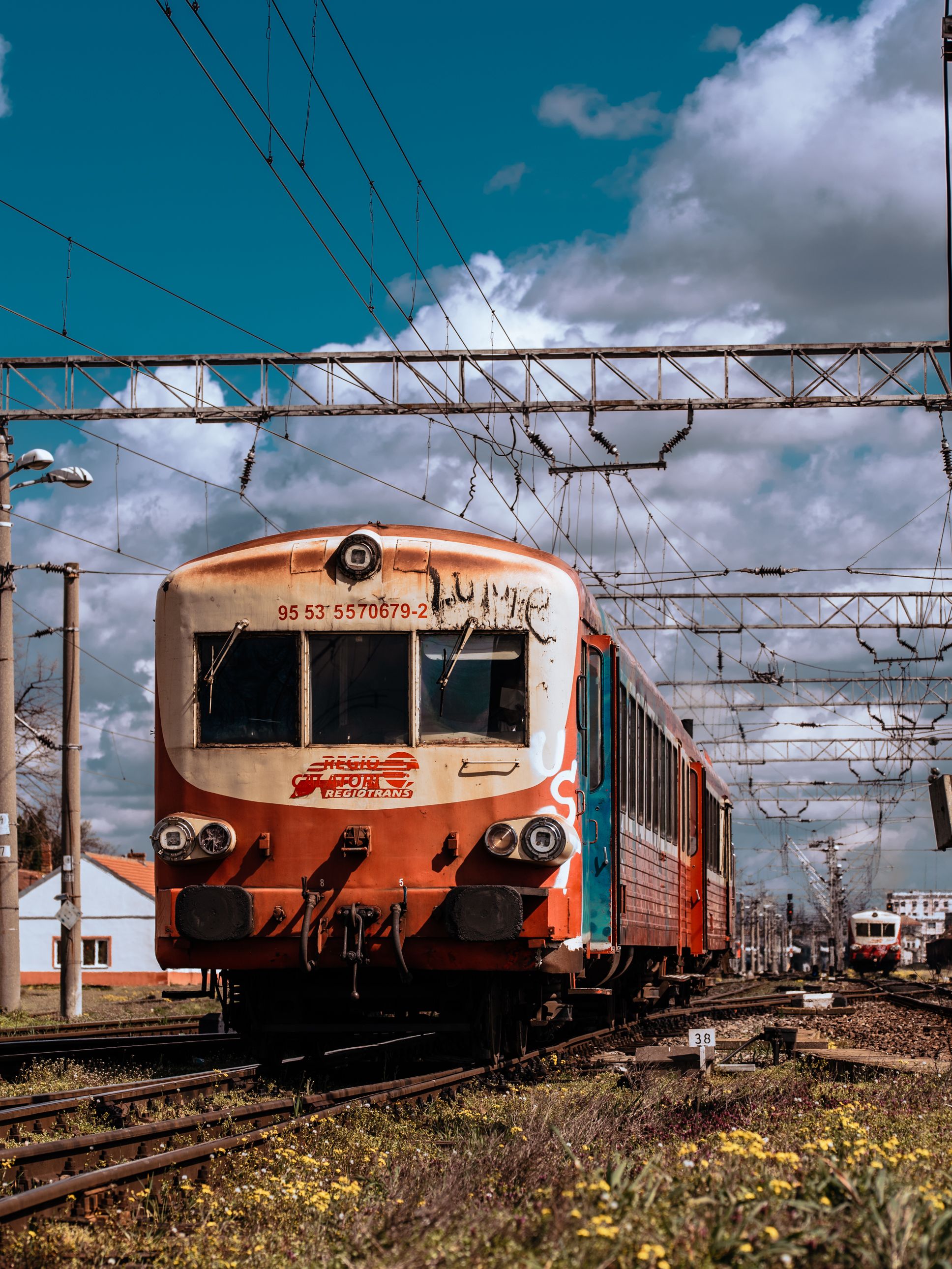 A train is traveling down the tracks in the sky · Free Stock Photo