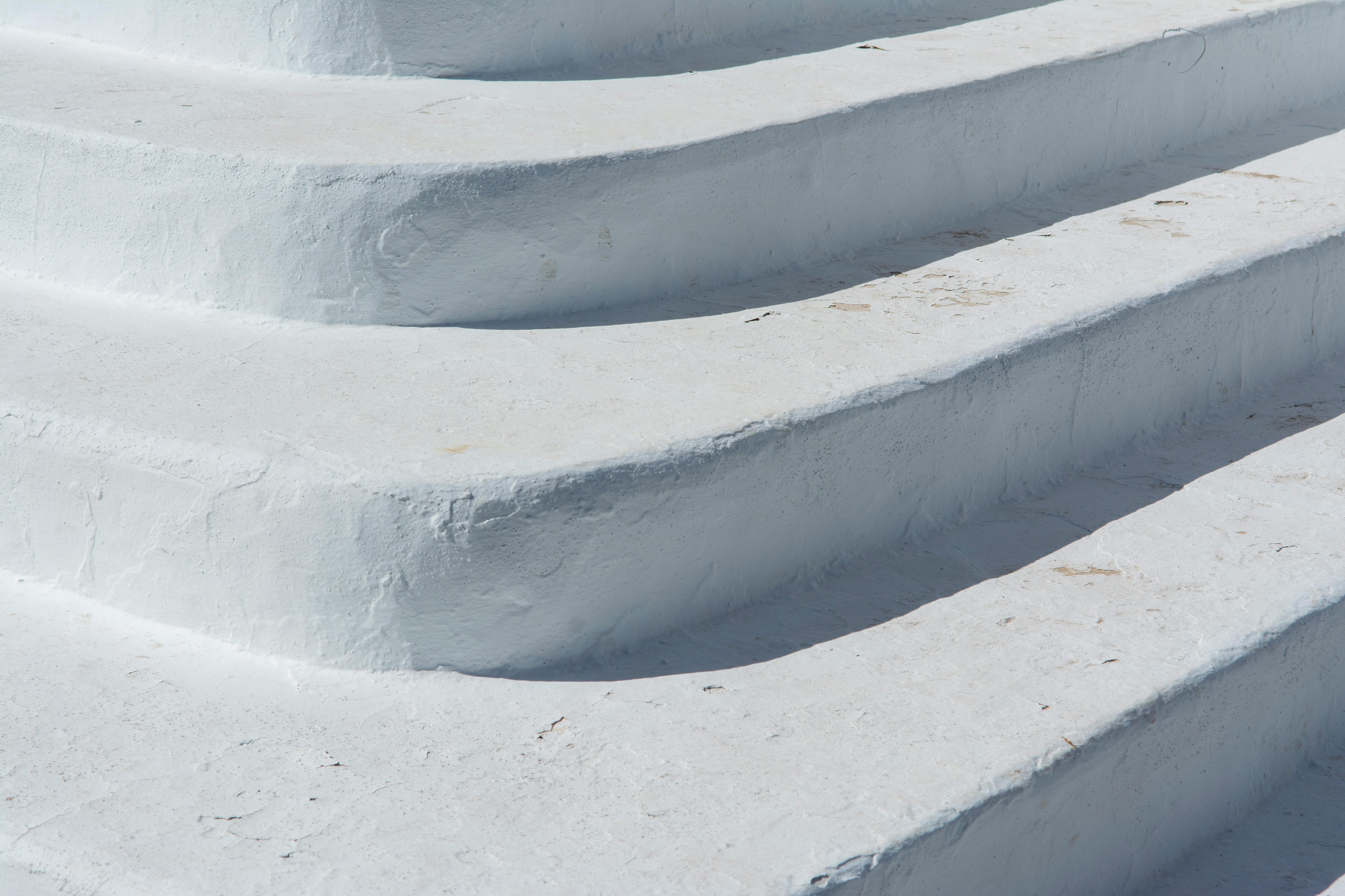 A white stairway with steps leading up to a building · Free Stock Photo