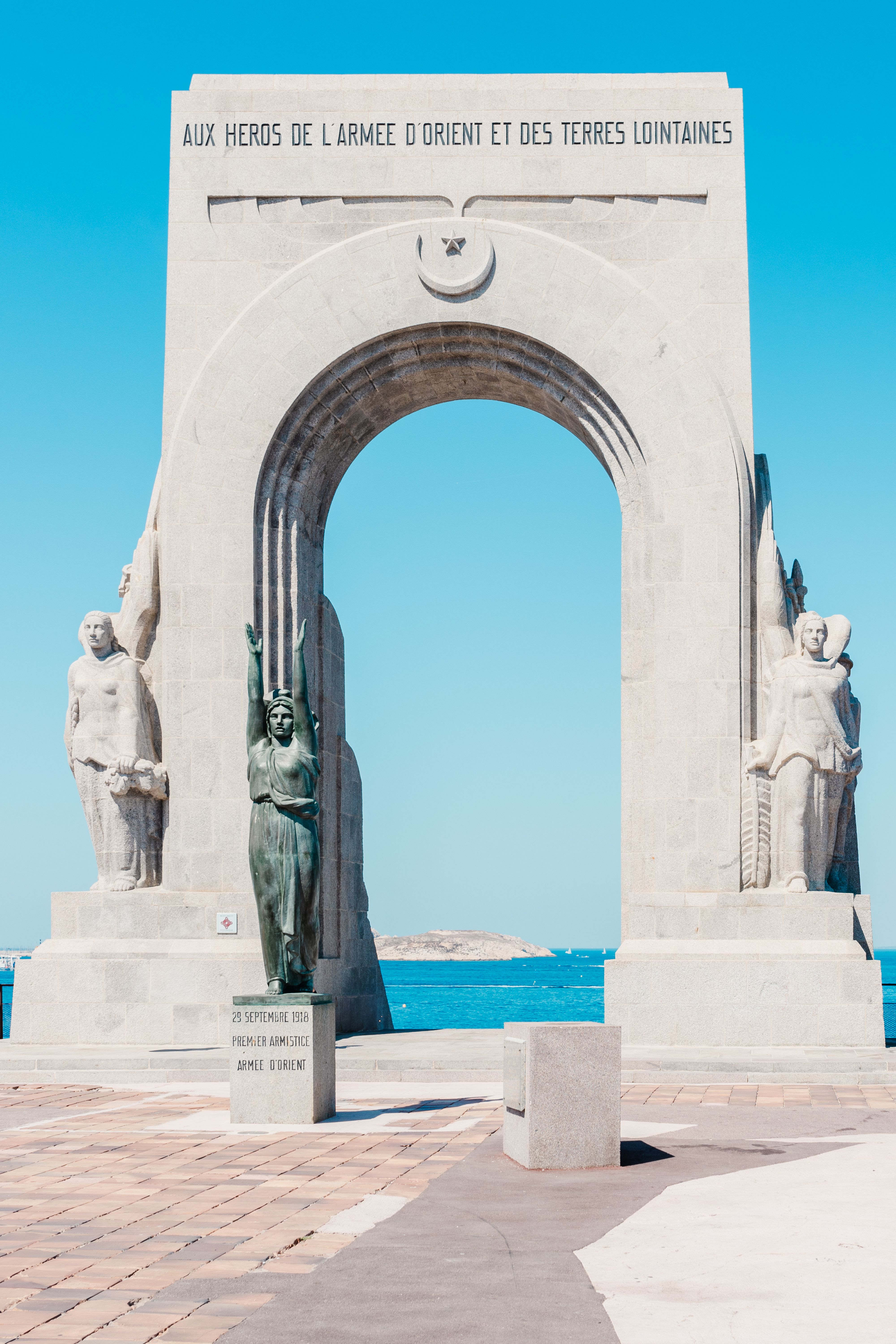 The monument is in front of the ocean · Free Stock Photo