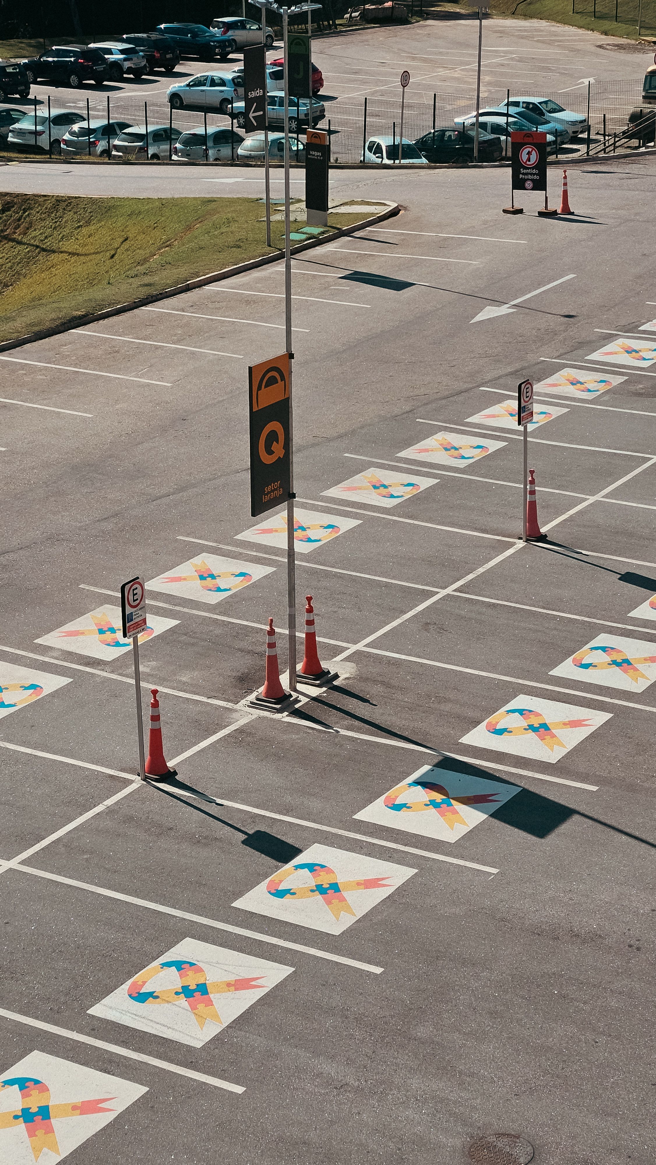 A parking lot with a crosswalk and traffic cones · Free Stock Photo