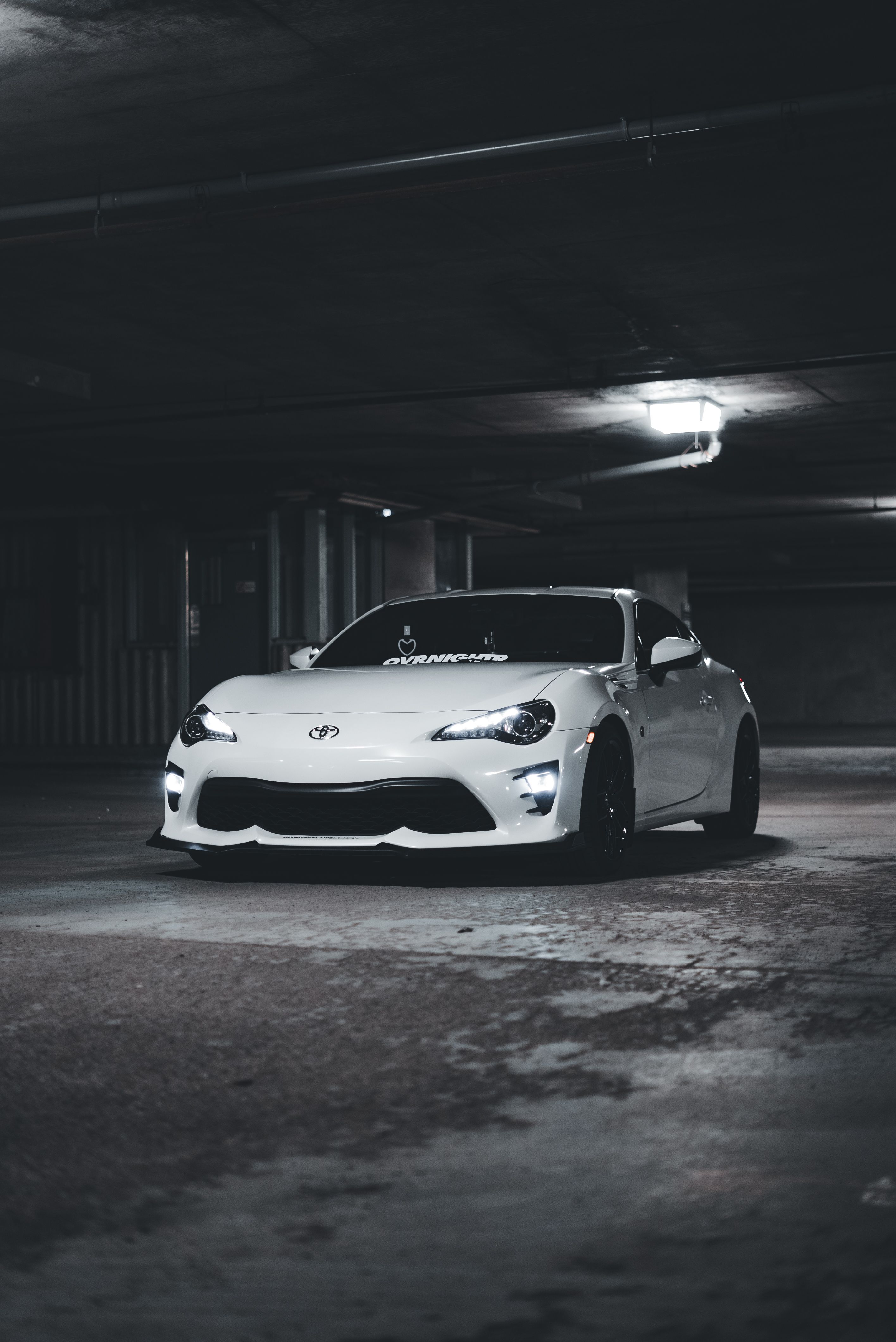 White Toyota Sports Car Parked in an Underground Parking Lot · Free ...