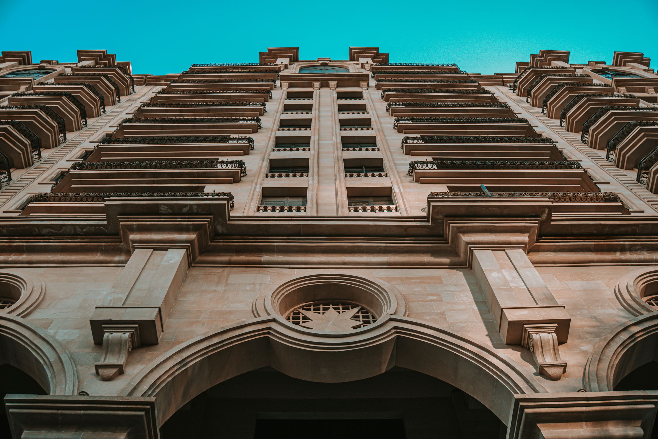The top of a tall building with a clock on it · Free Stock Photo