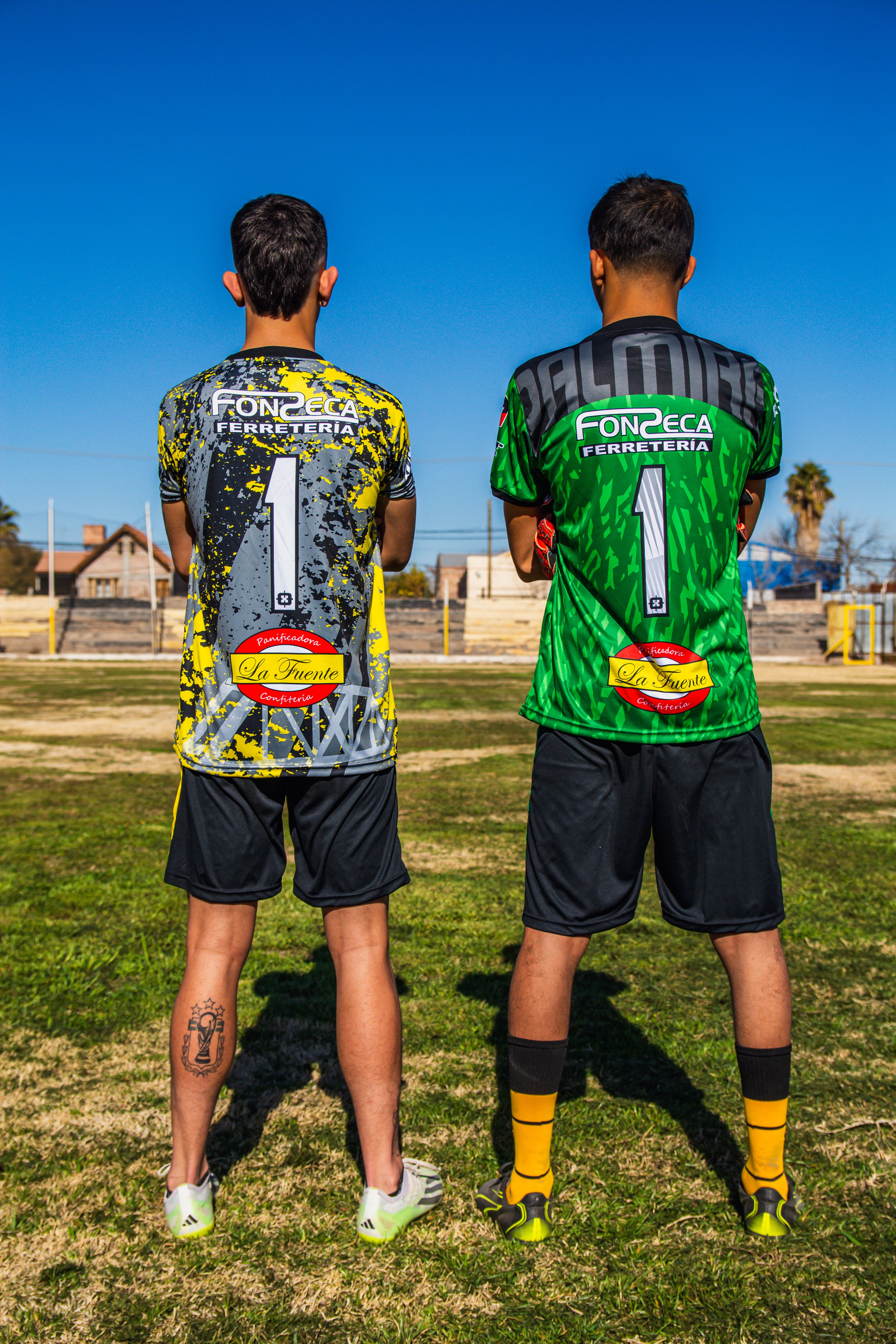 Two soccer players standing on a field · Free Stock Photo