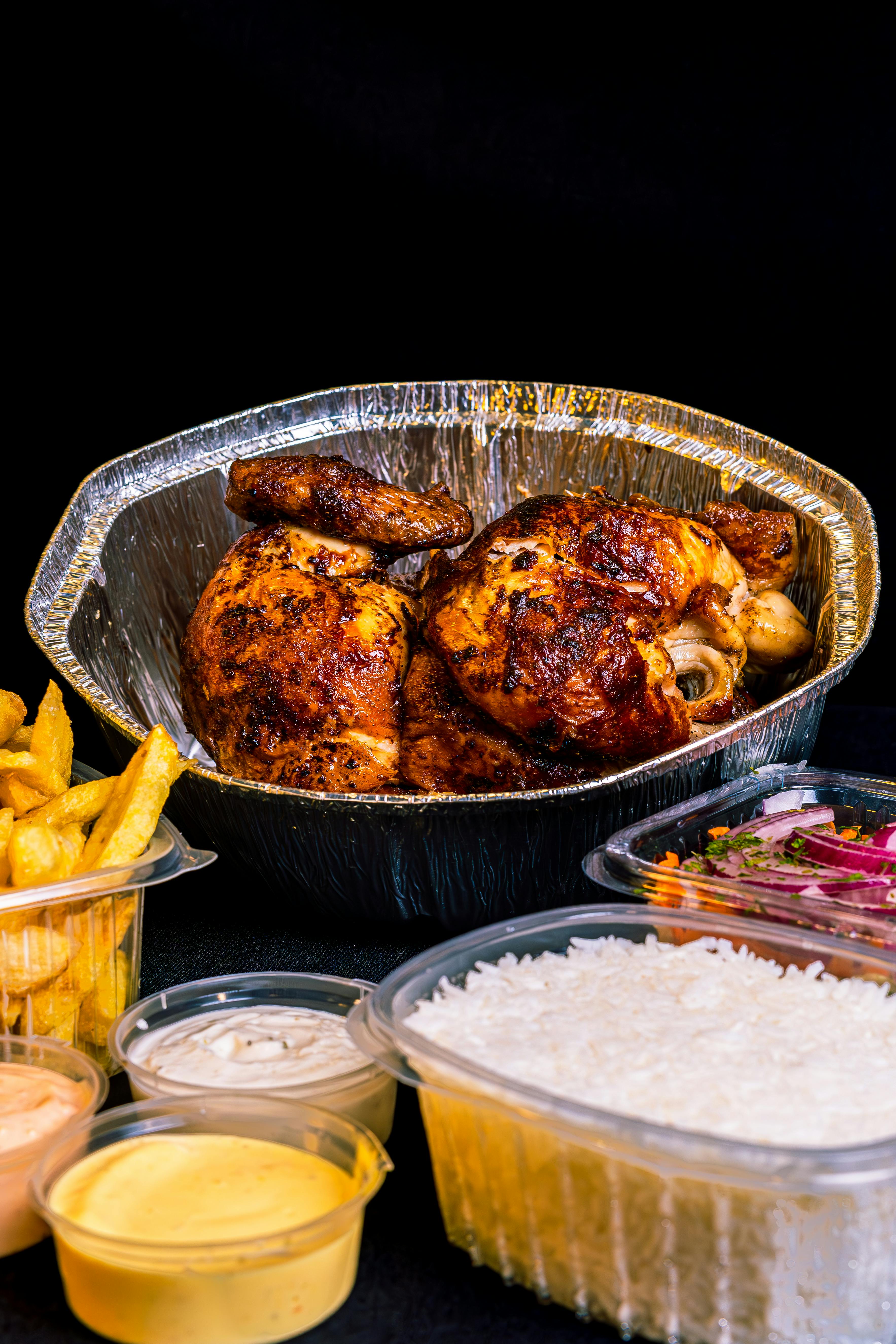 A tray of chicken, rice and fries · Free Stock Photo