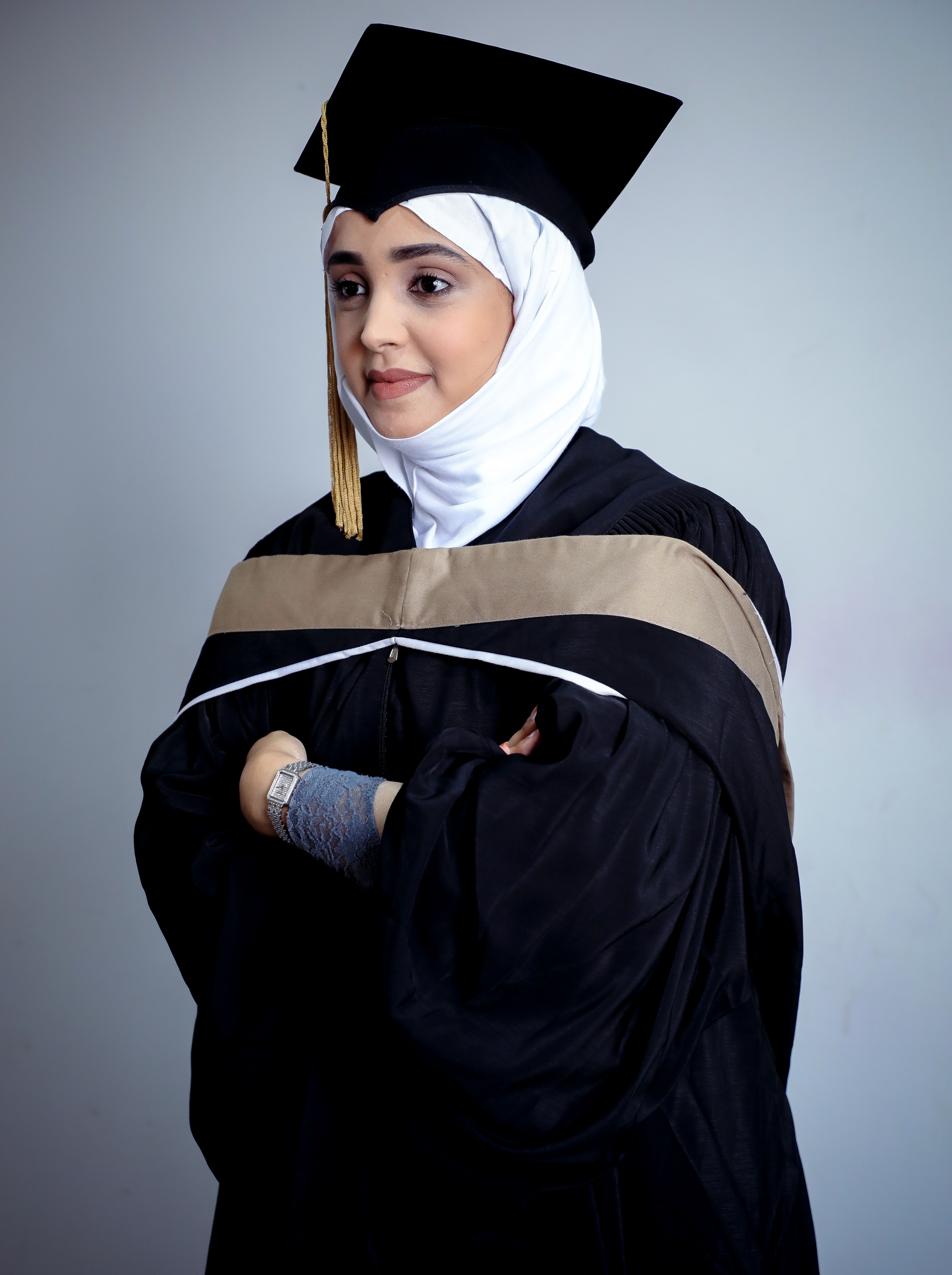 A Person Holding a Black Graduation Hat · Free Stock Photo
