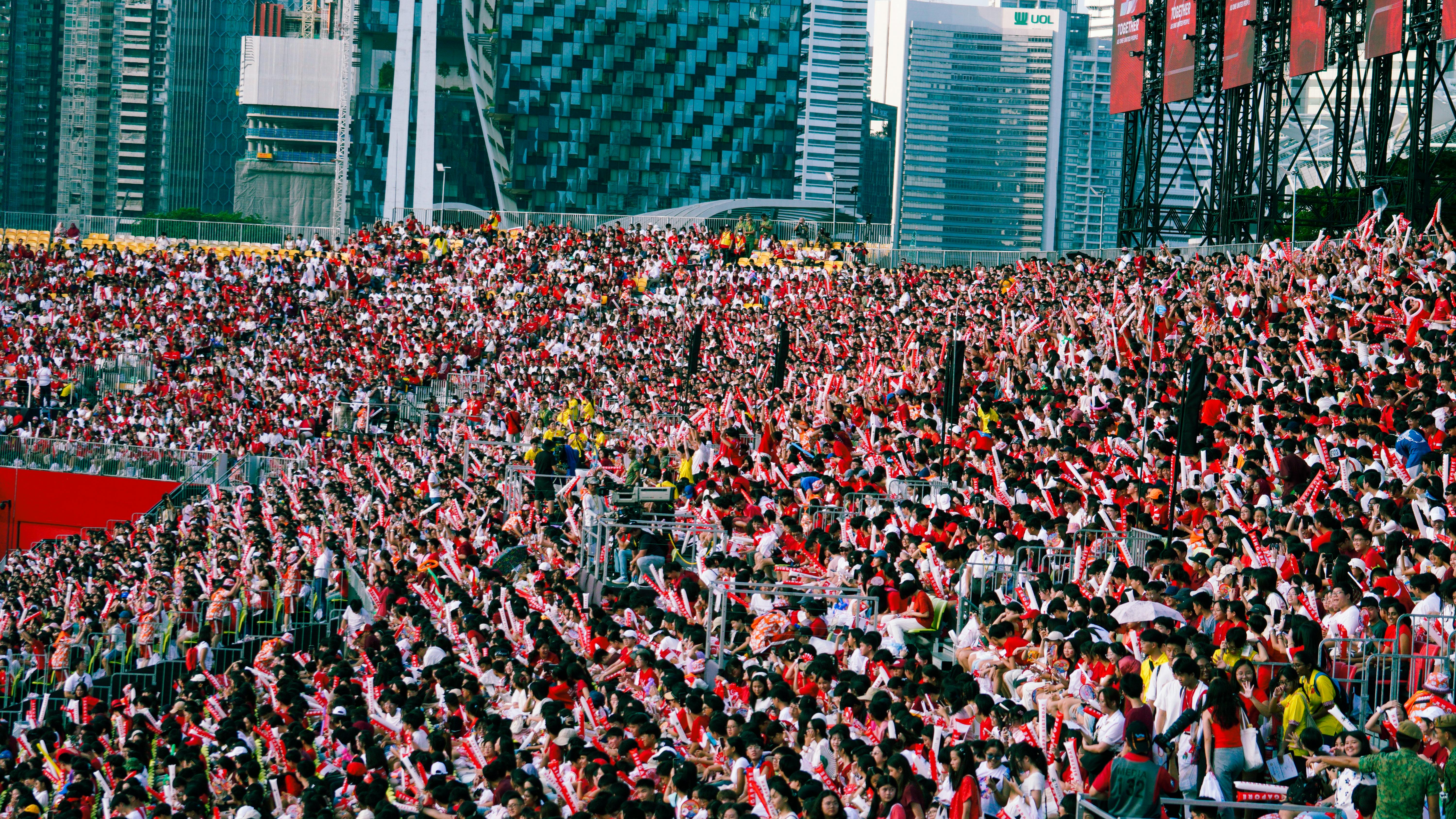 A large crowd of people in a stadium · Free Stock Photo