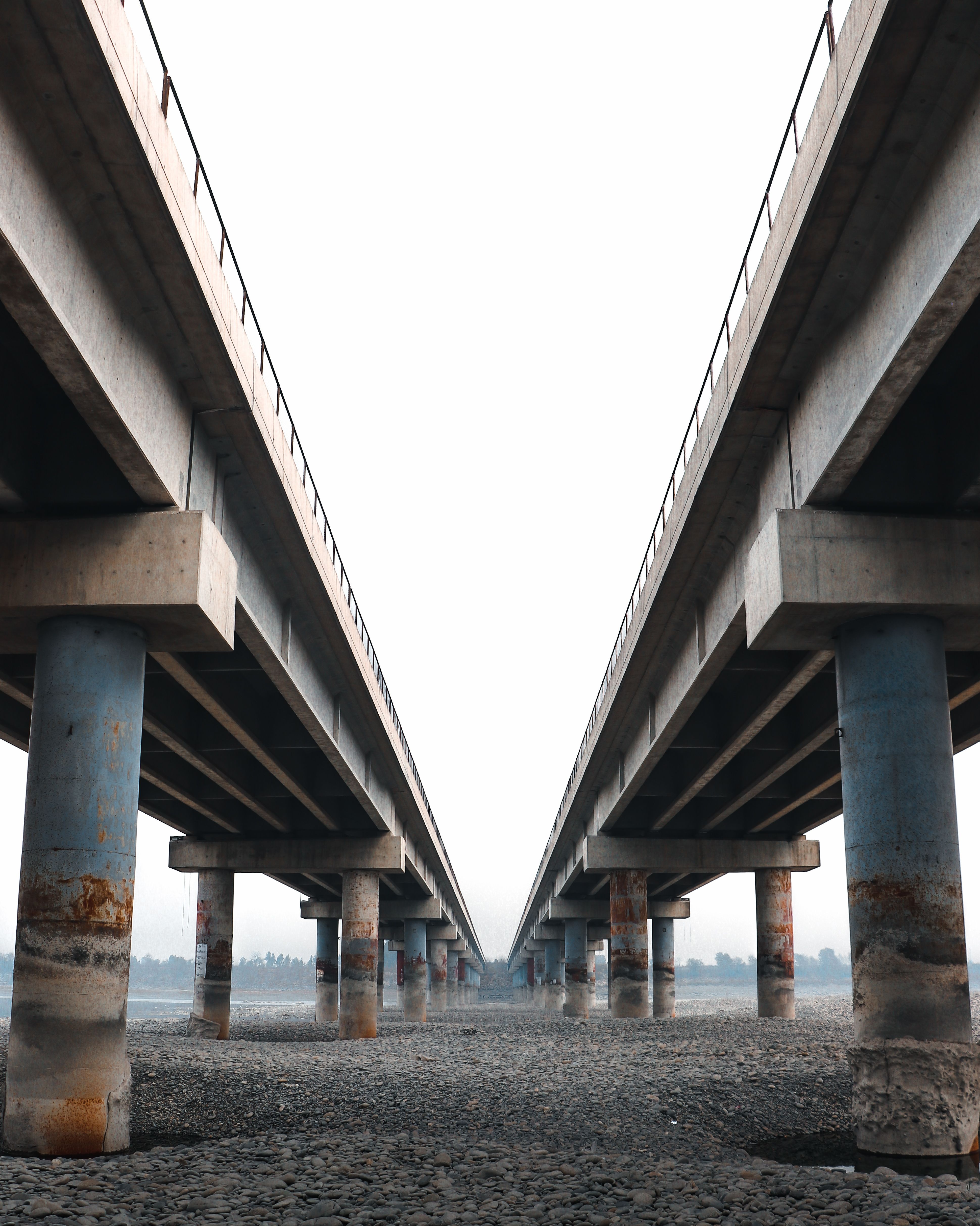 The underside of a bridge with two columns · Free Stock Photo