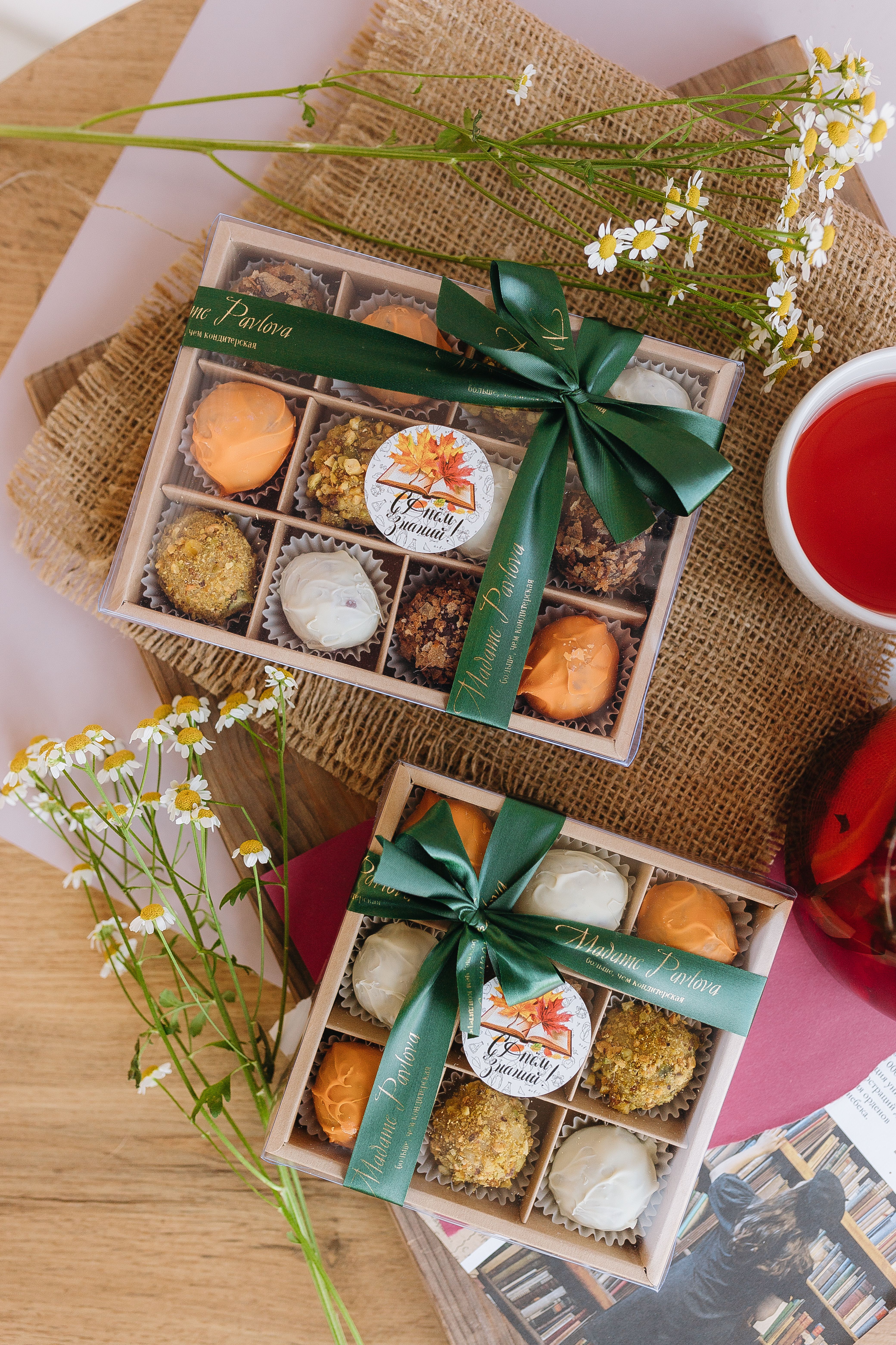 A box of chocolates and tea on a table · Free Stock Photo