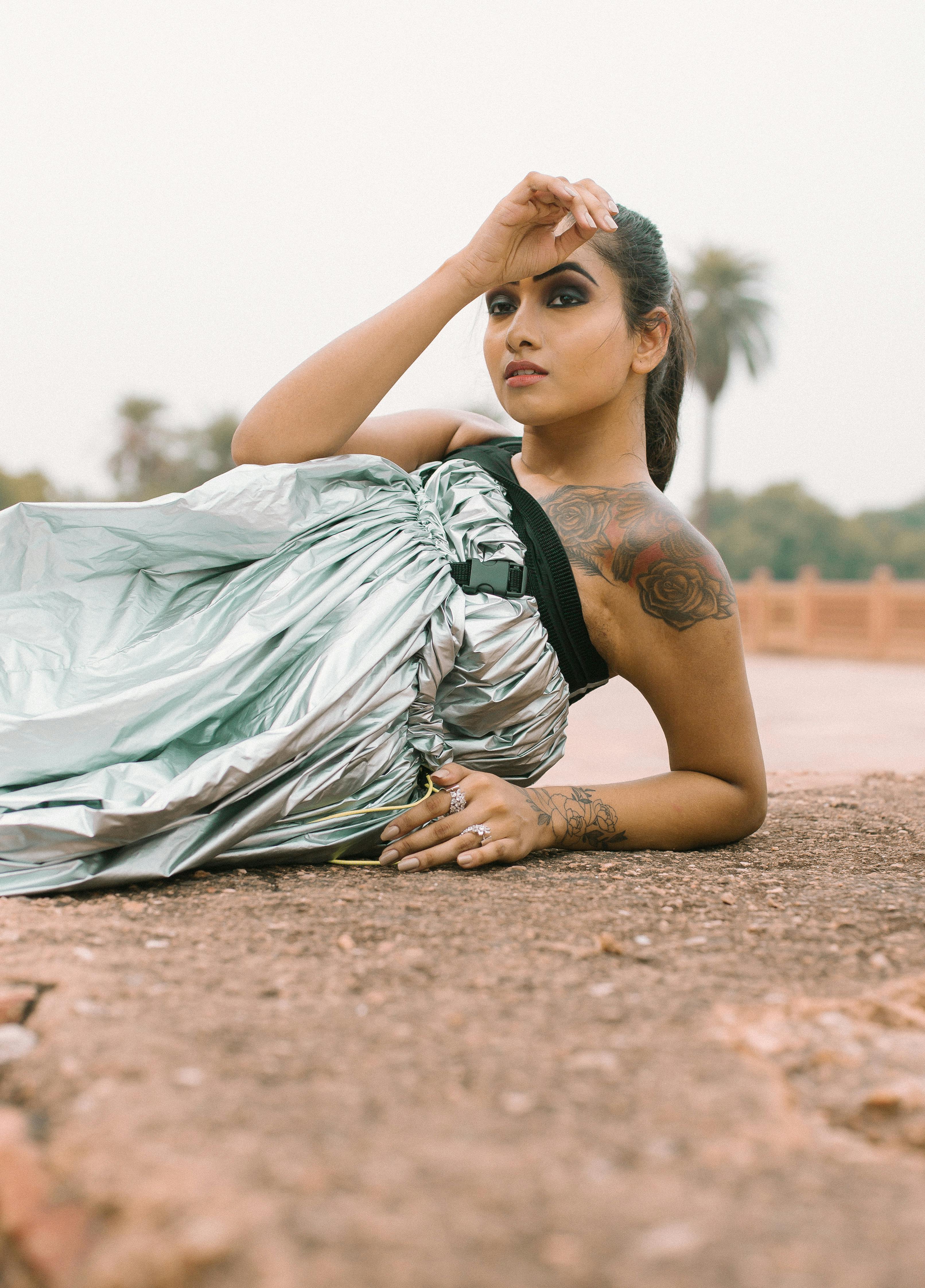Photo of Woman Holding Pink Flower · Free Stock Photo