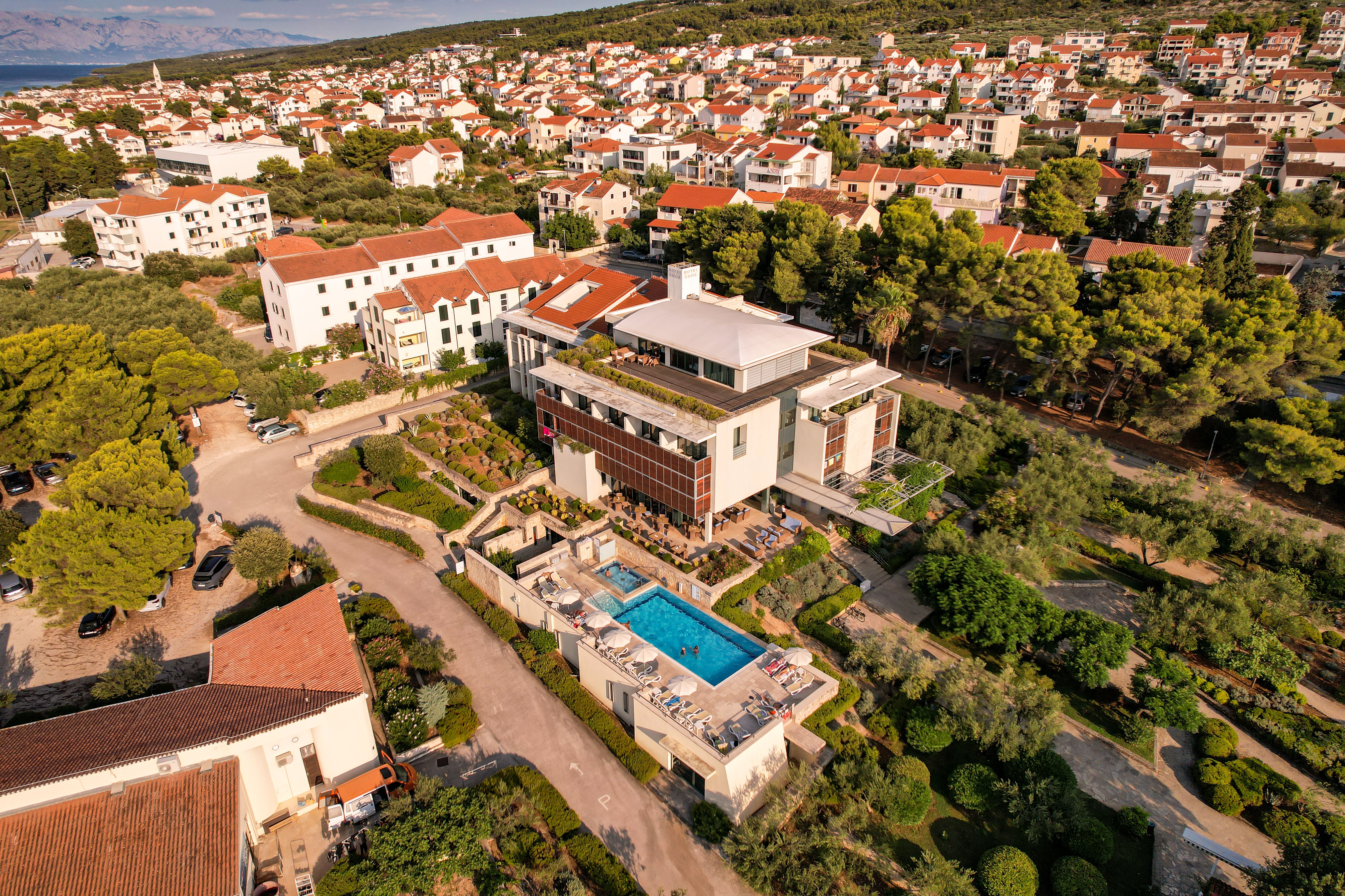 The aerial view of a hotel and swimming pool · Free Stock Photo