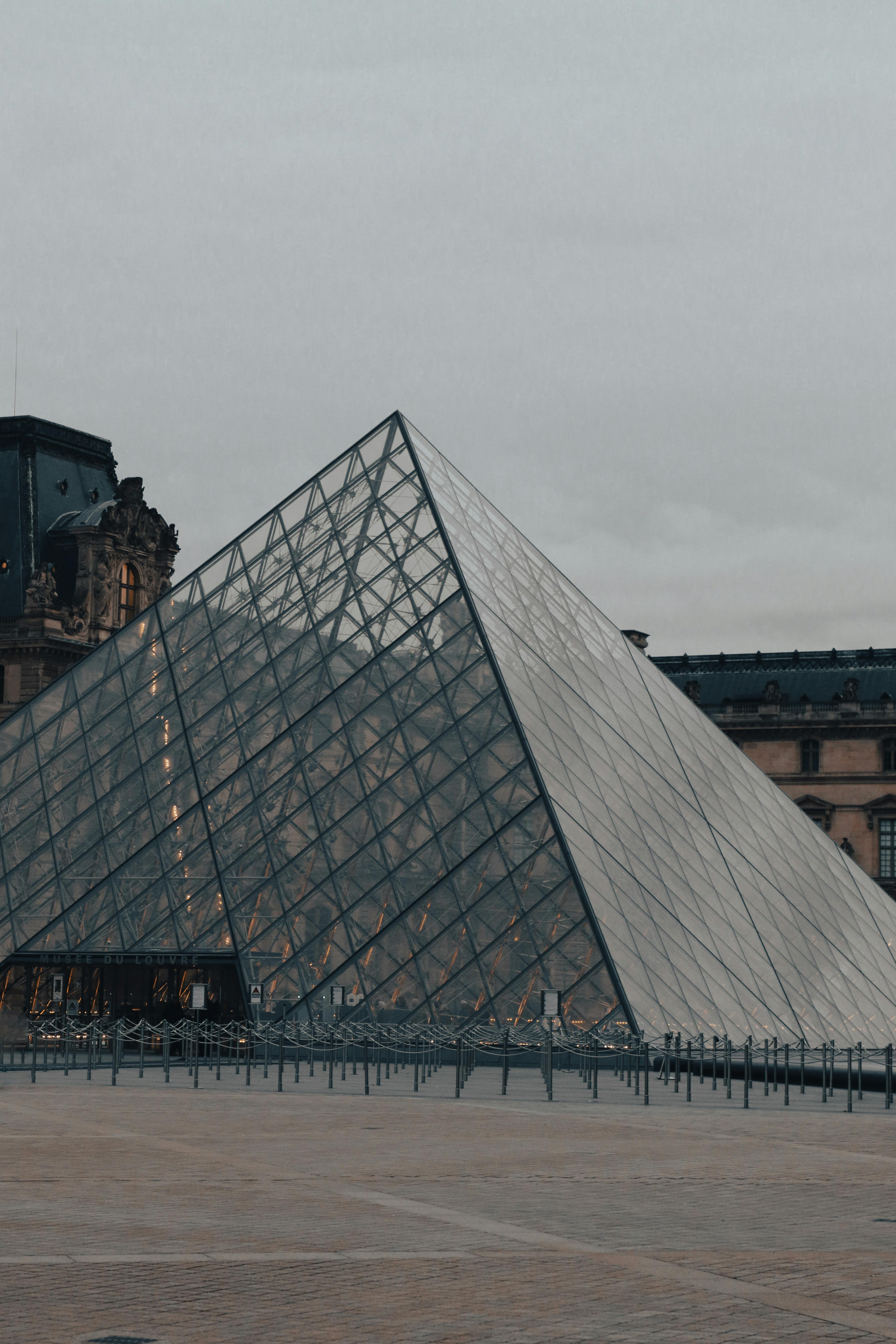 Metal Frame Glass Pyramid Outside a Museum With Yellow Lights during ...