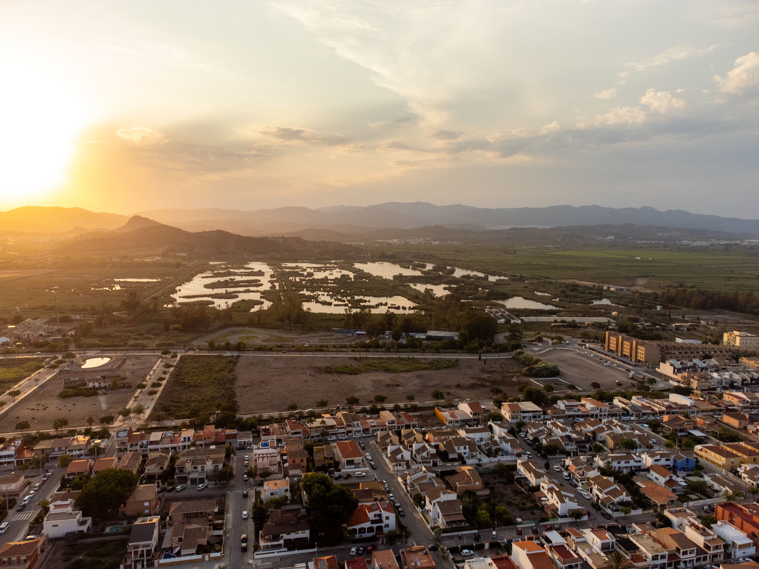 A bird's eye view of a city at sunset · Free Stock Photo