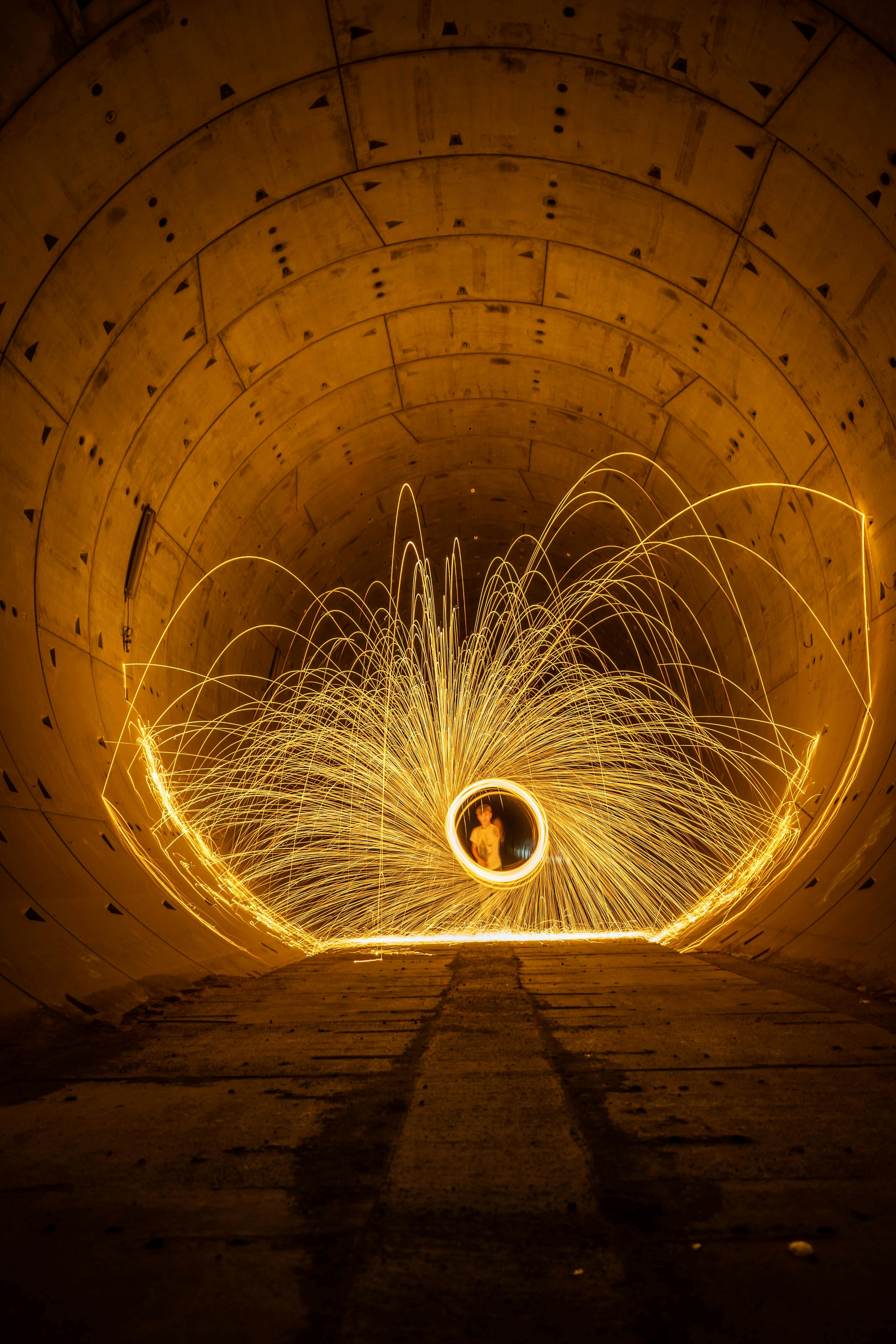 Man standing against lines of light in circle from fire swing · Free ...