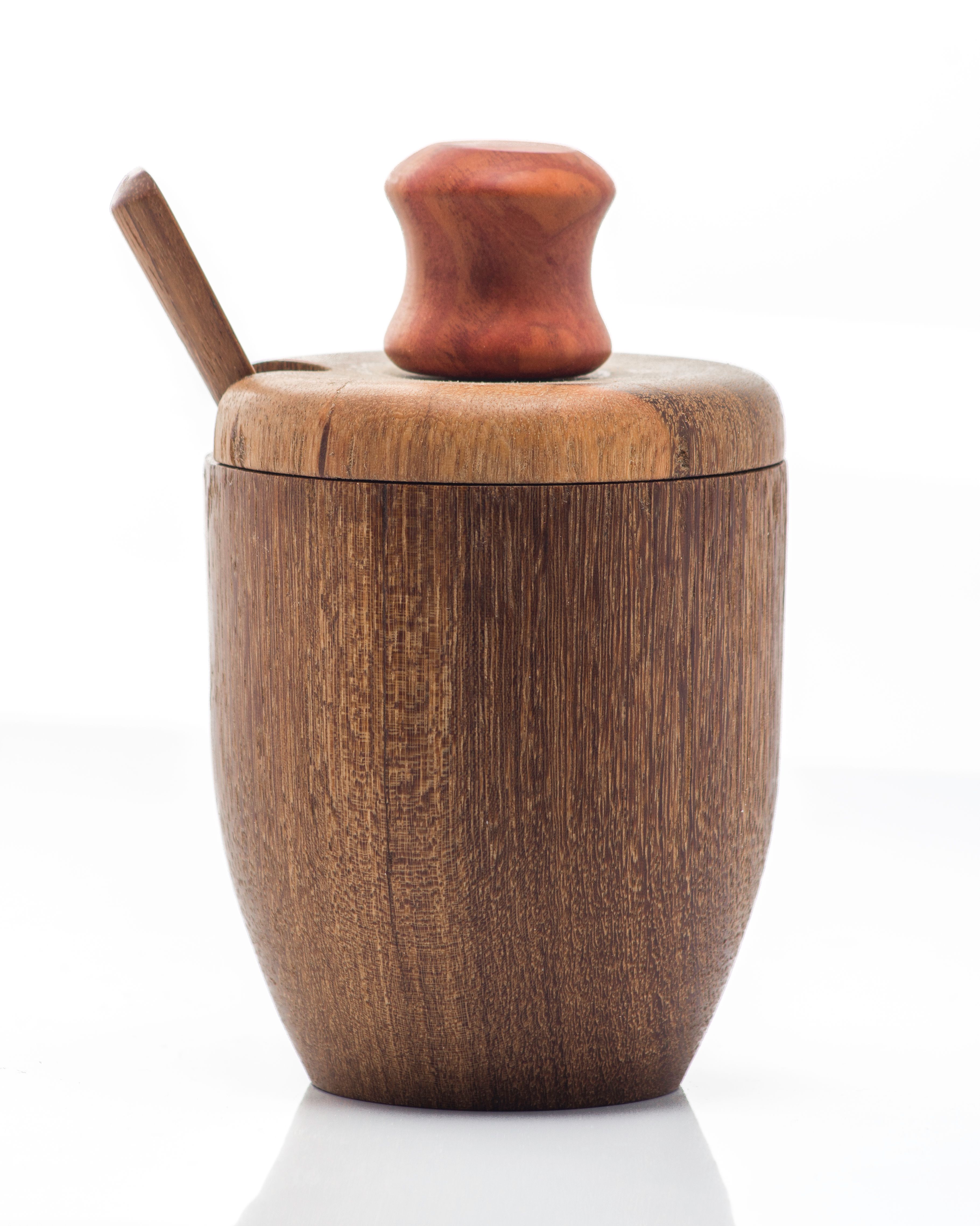 A wooden container with a wooden spoon and lid · Free Stock Photo