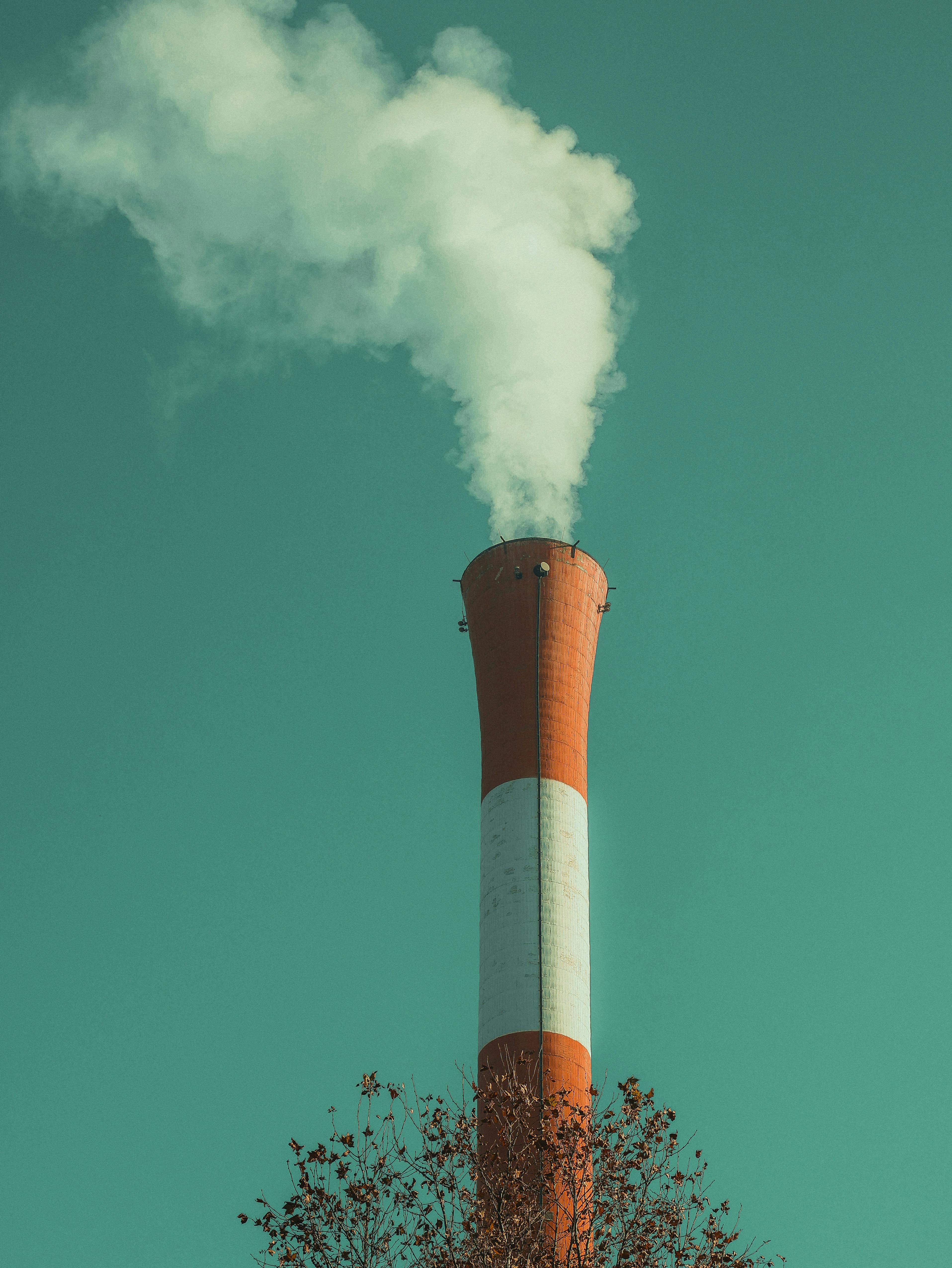 Smoke Stacks Against Blue Sky · Free Stock Photo