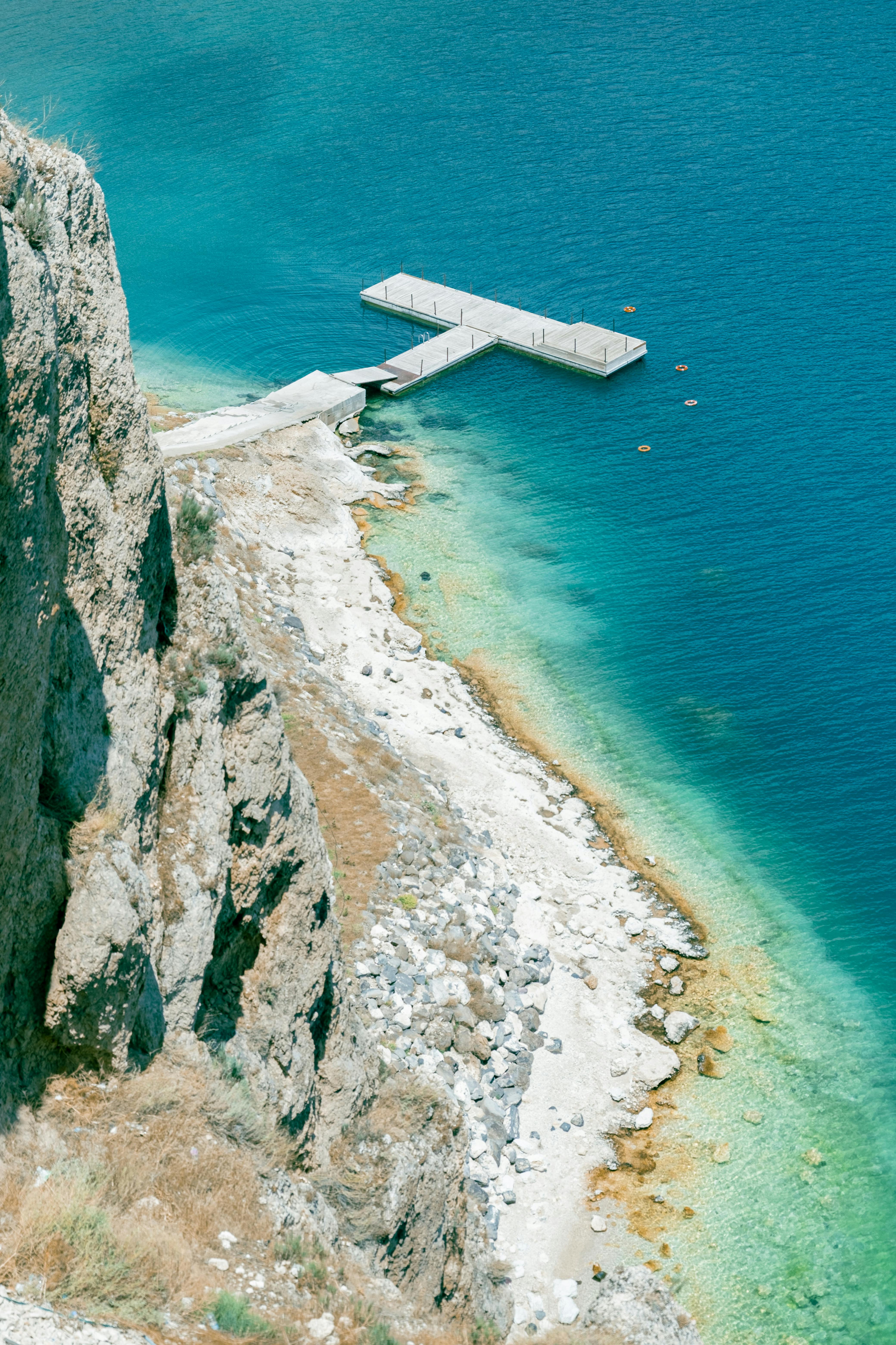 A boat dock on the side of a cliff · Free Stock Photo