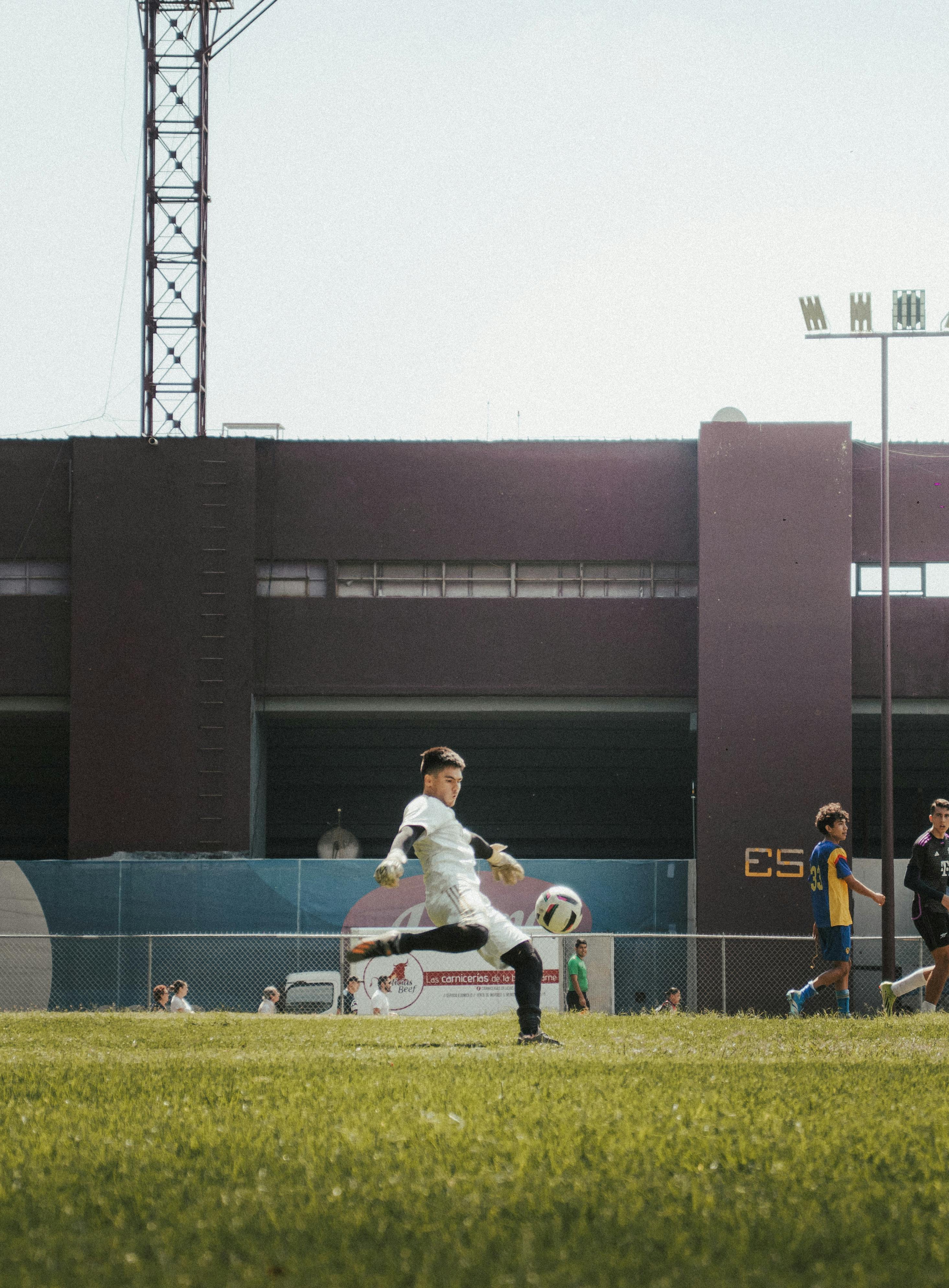 Grayscale Photography Of Man Playing Soccer · Free Stock Photo