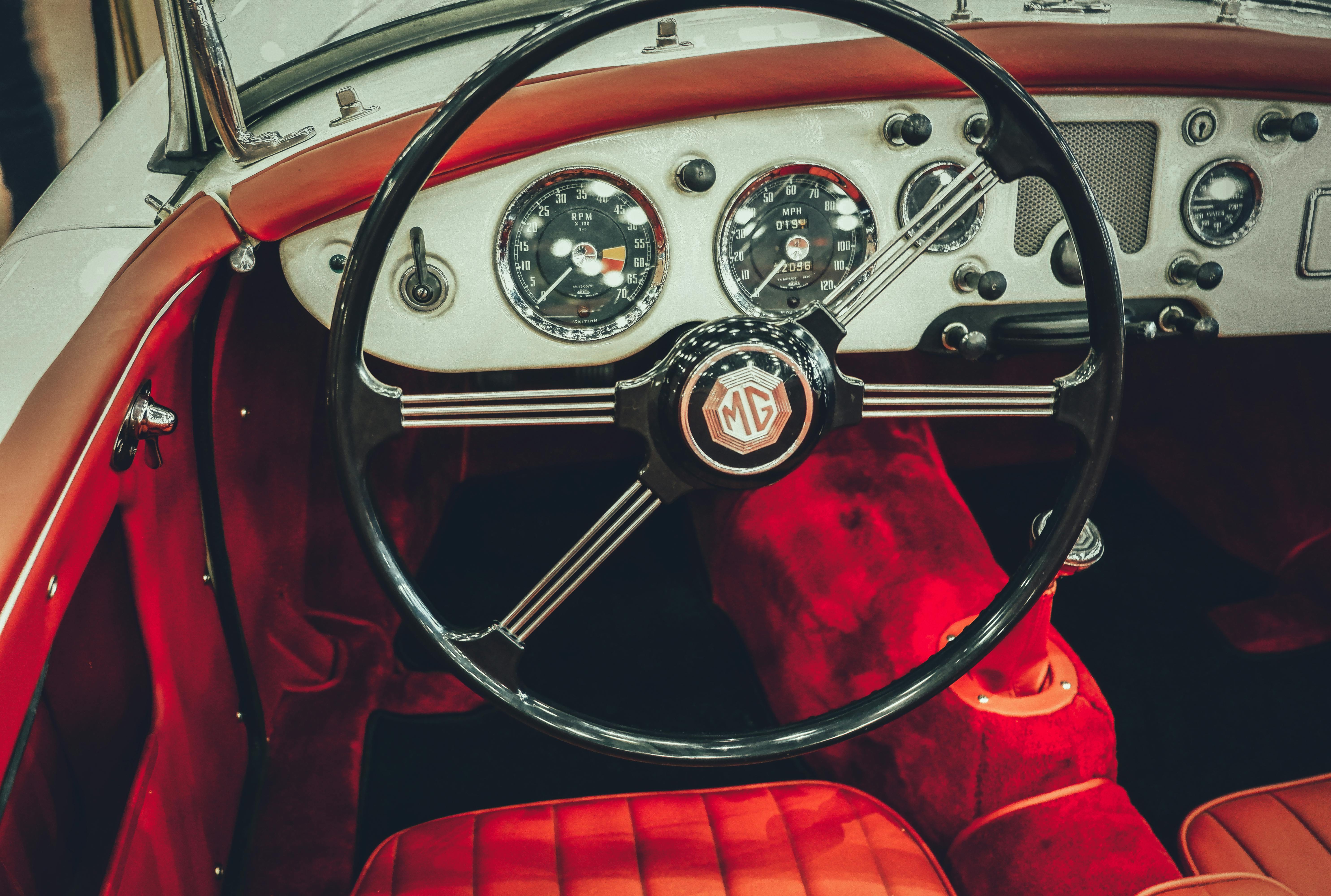 Vintage Car Interior with Steering Wheel and Dashboard · Free Stock Photo