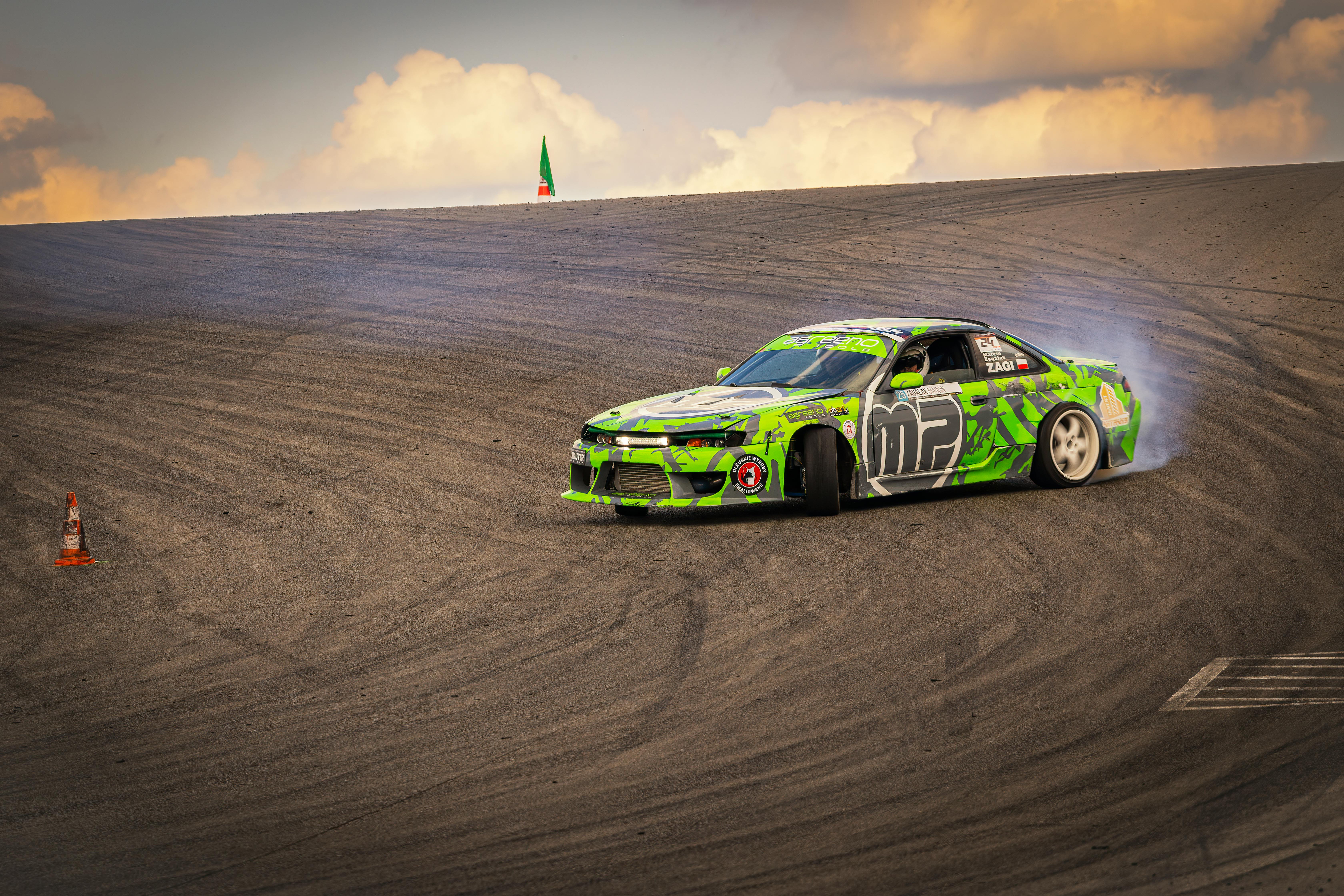 Black Race Car Drifting on Race Track · Free Stock Photo